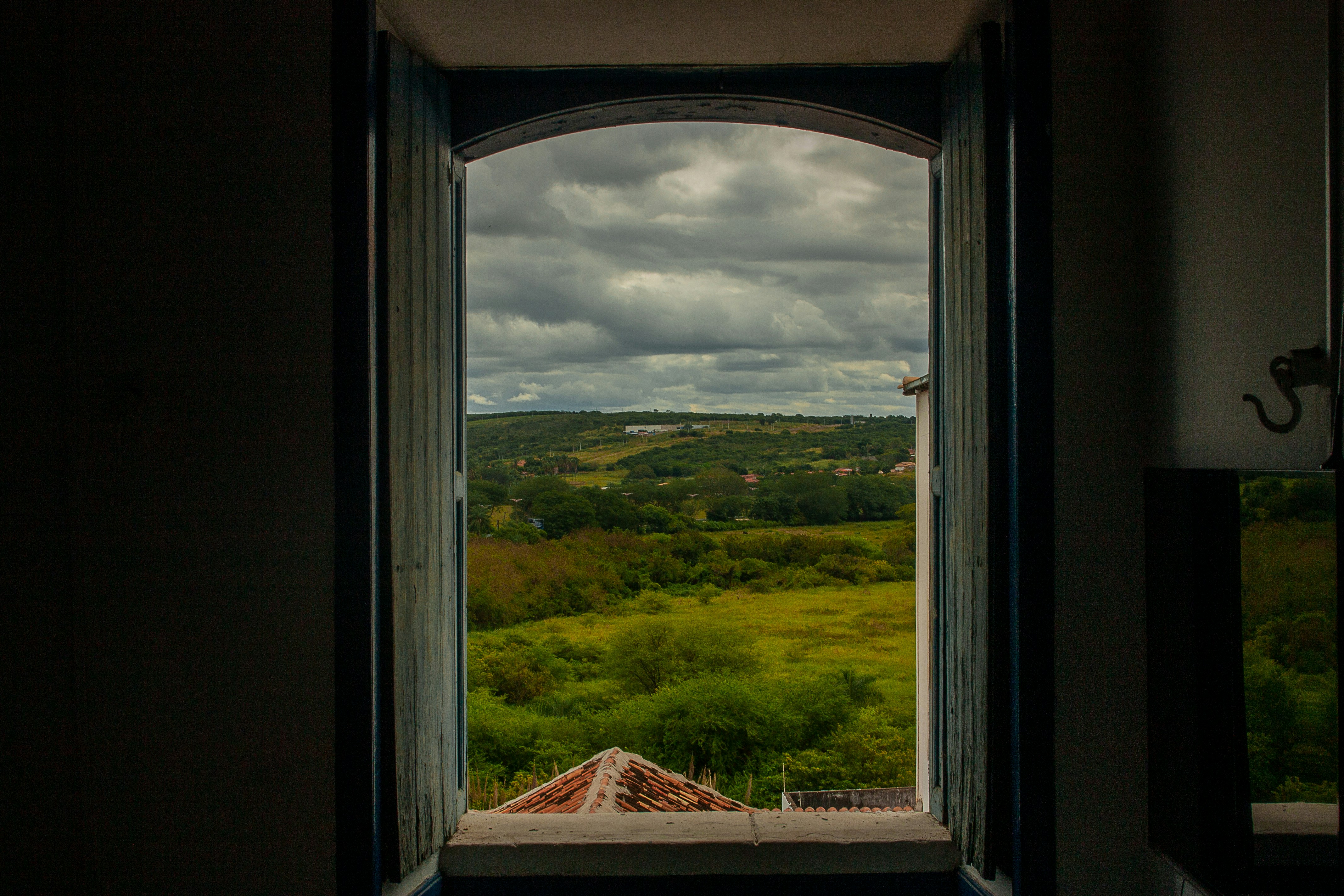 View Through an Old Window to a Rolling Countryside