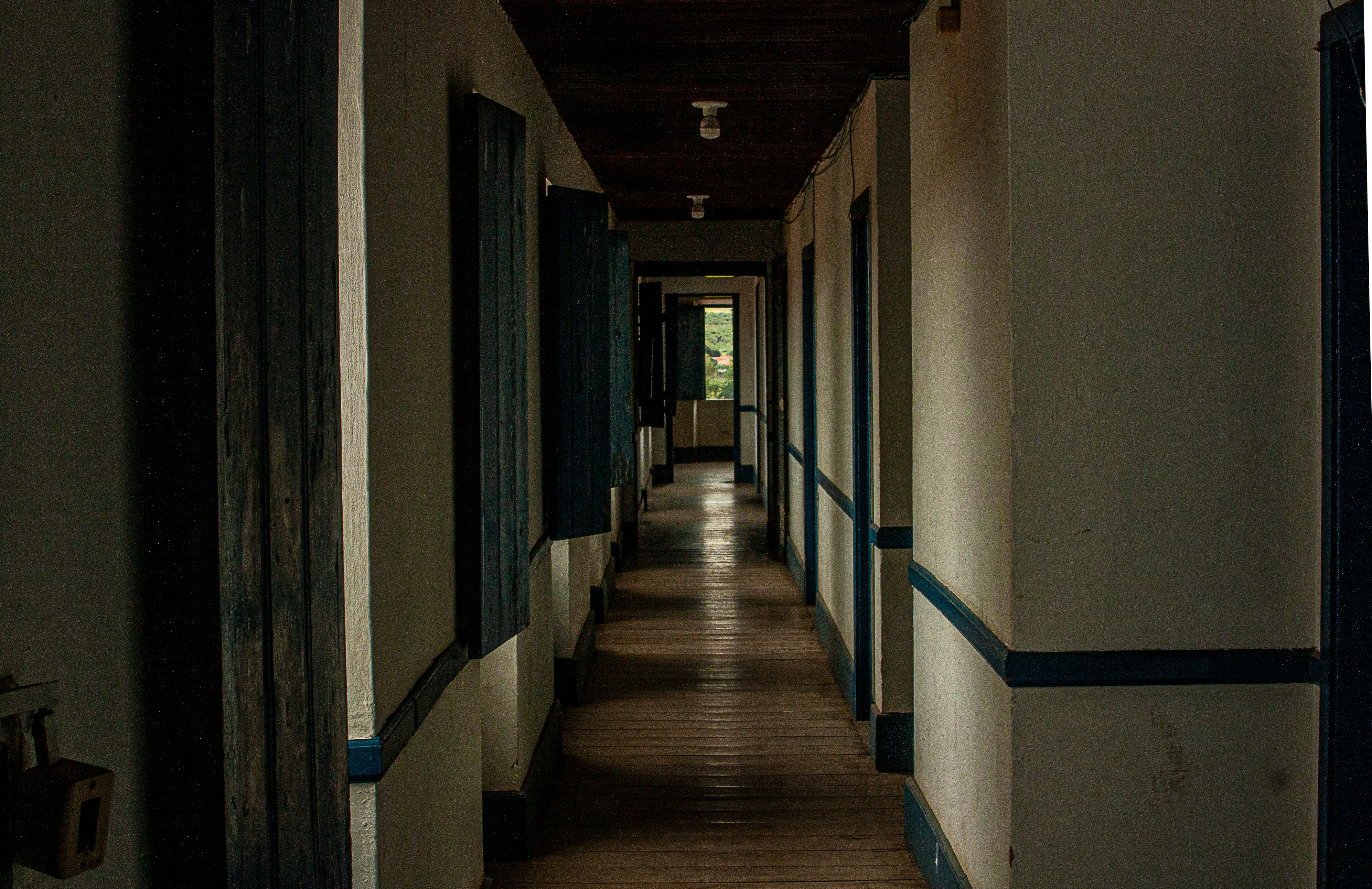 Echoes Down the Corridor: A Dim Hallway of Quiet Distance