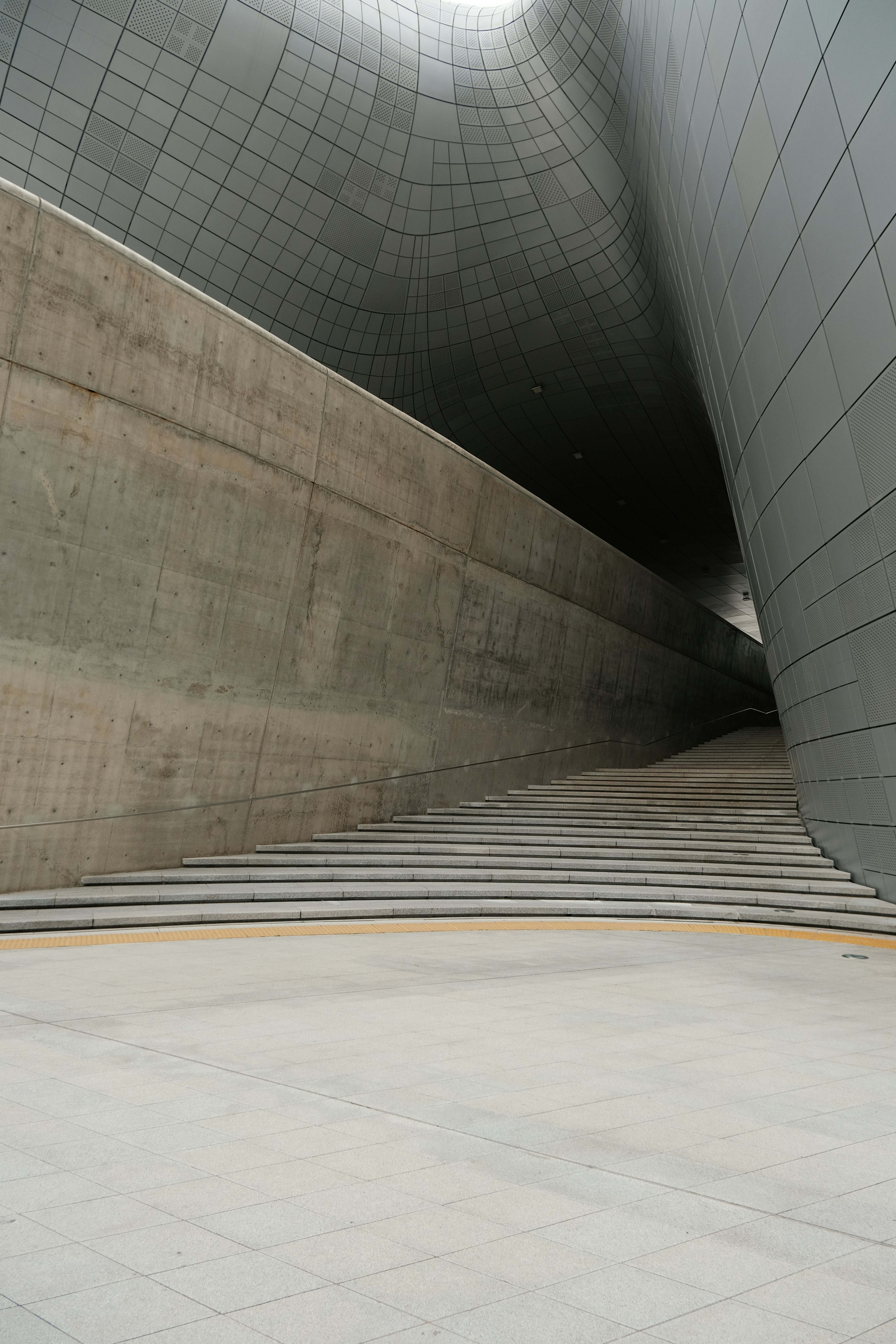 Converging Curves: Staircase into the Cylindrical Atrium
