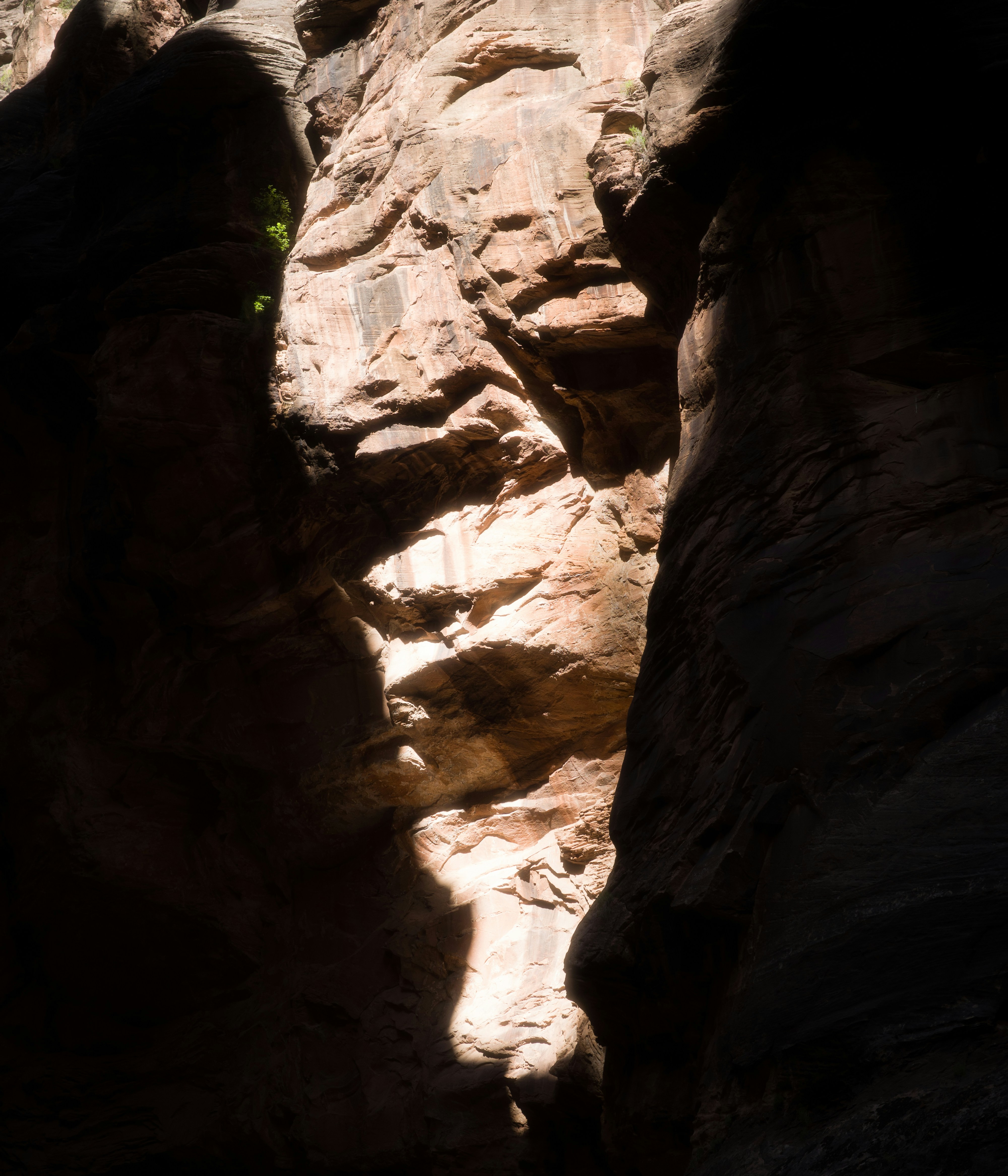 Sunlit Slip Between Ancient Red Walls