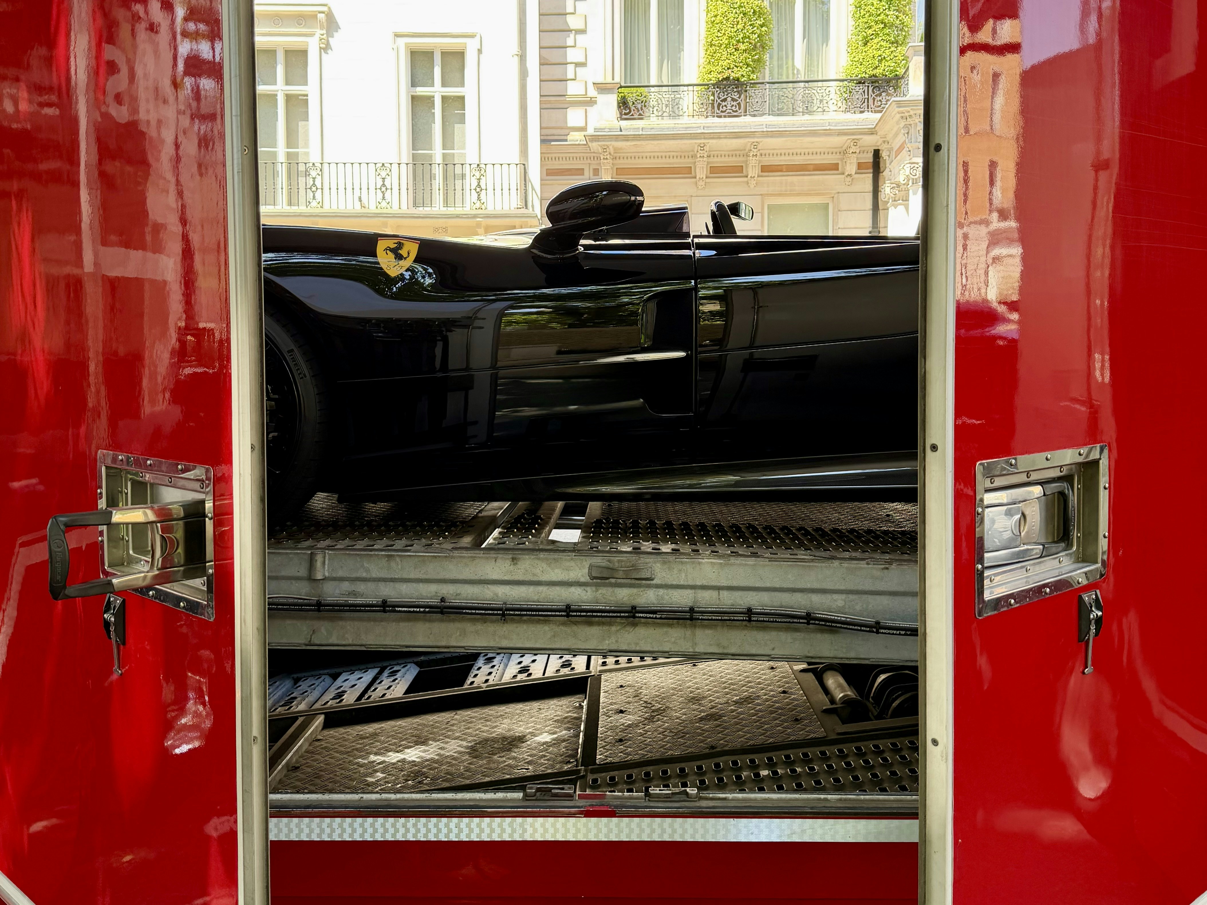 Red Door Adventure: The Open Garage and a Sleek Car Inside