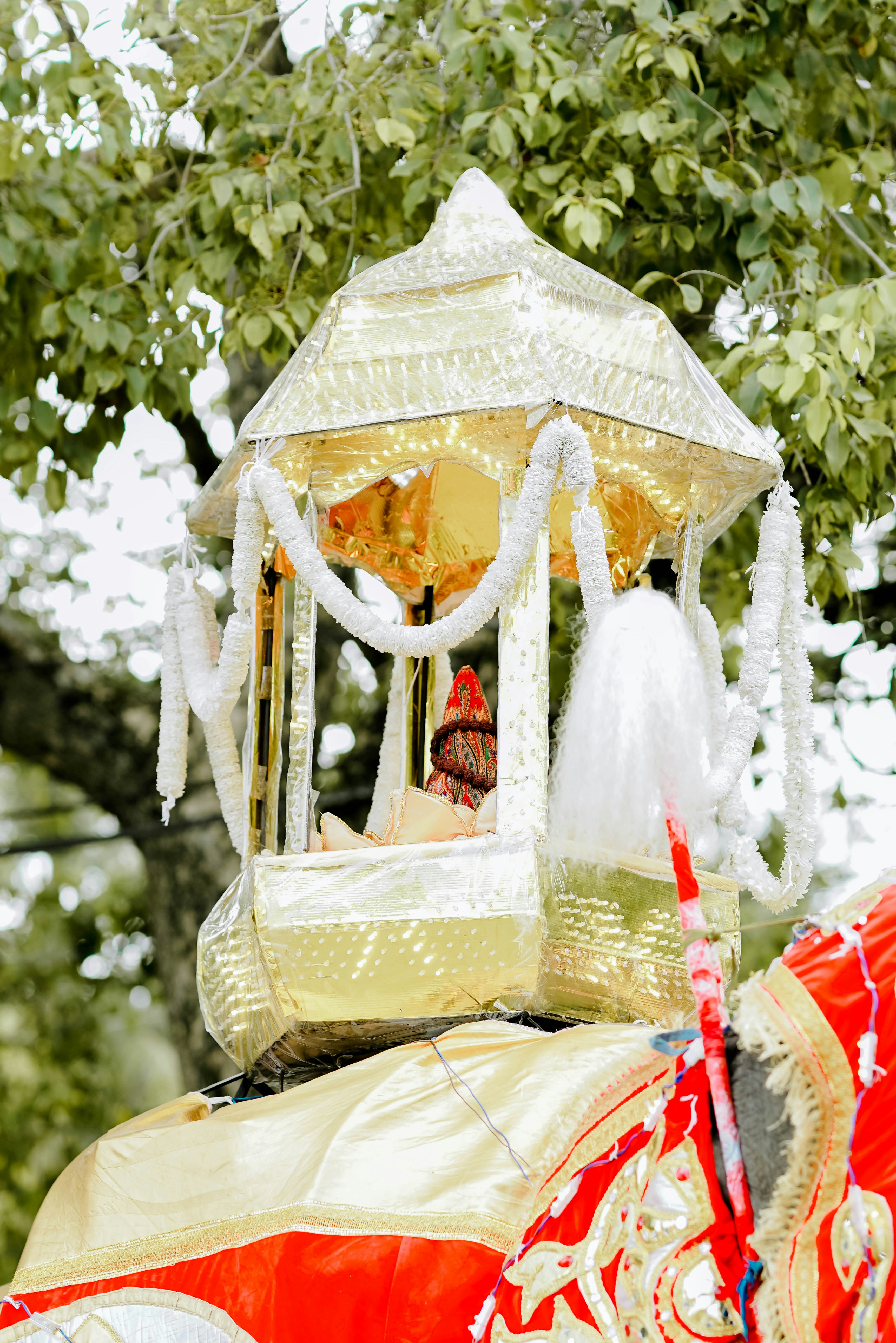 Gilded Shrine Carriage: a ceremonial lantern atop a golden effigy