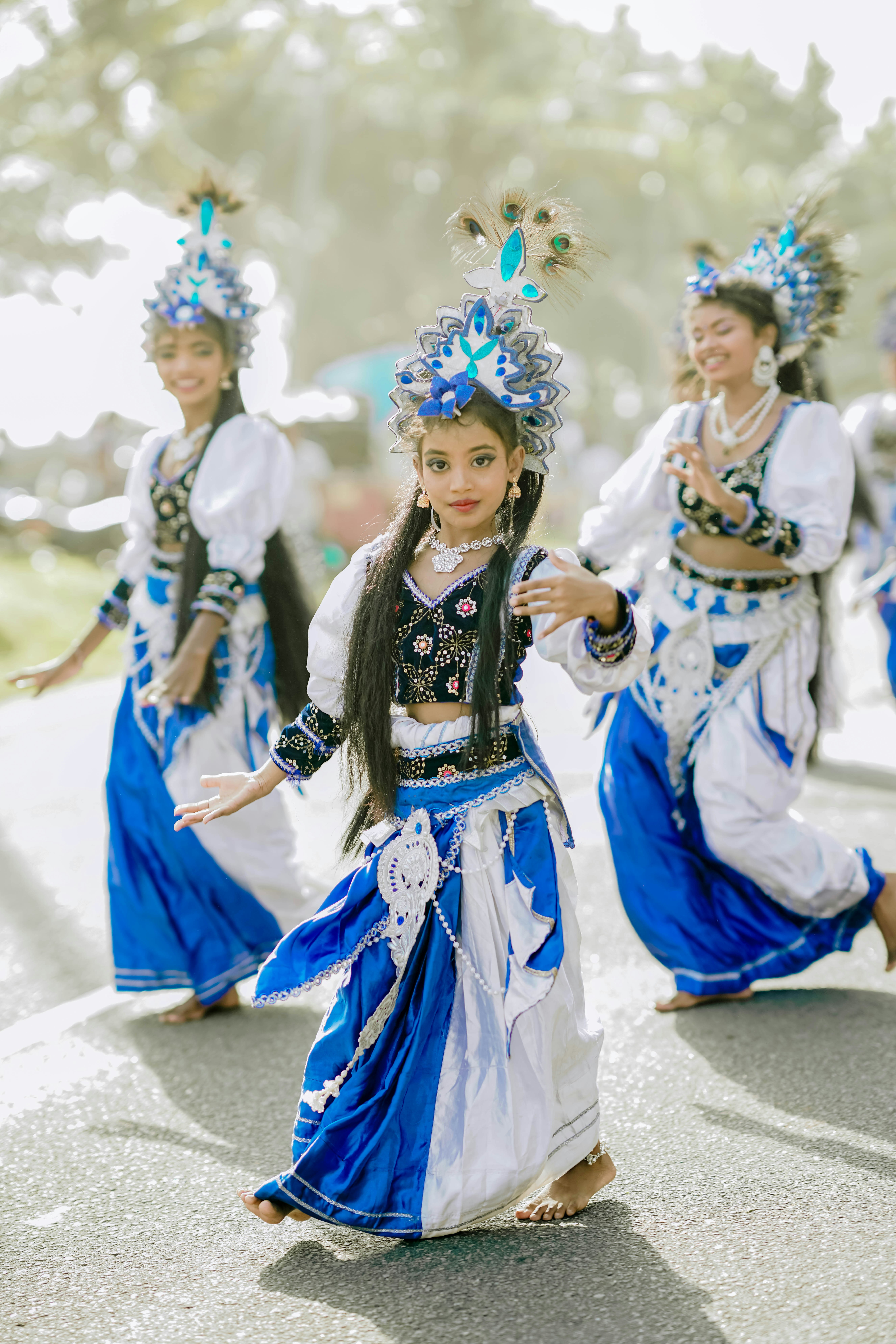 Blue-and-White Carnival: Center-Stage Dancer in Ceremonial Attire