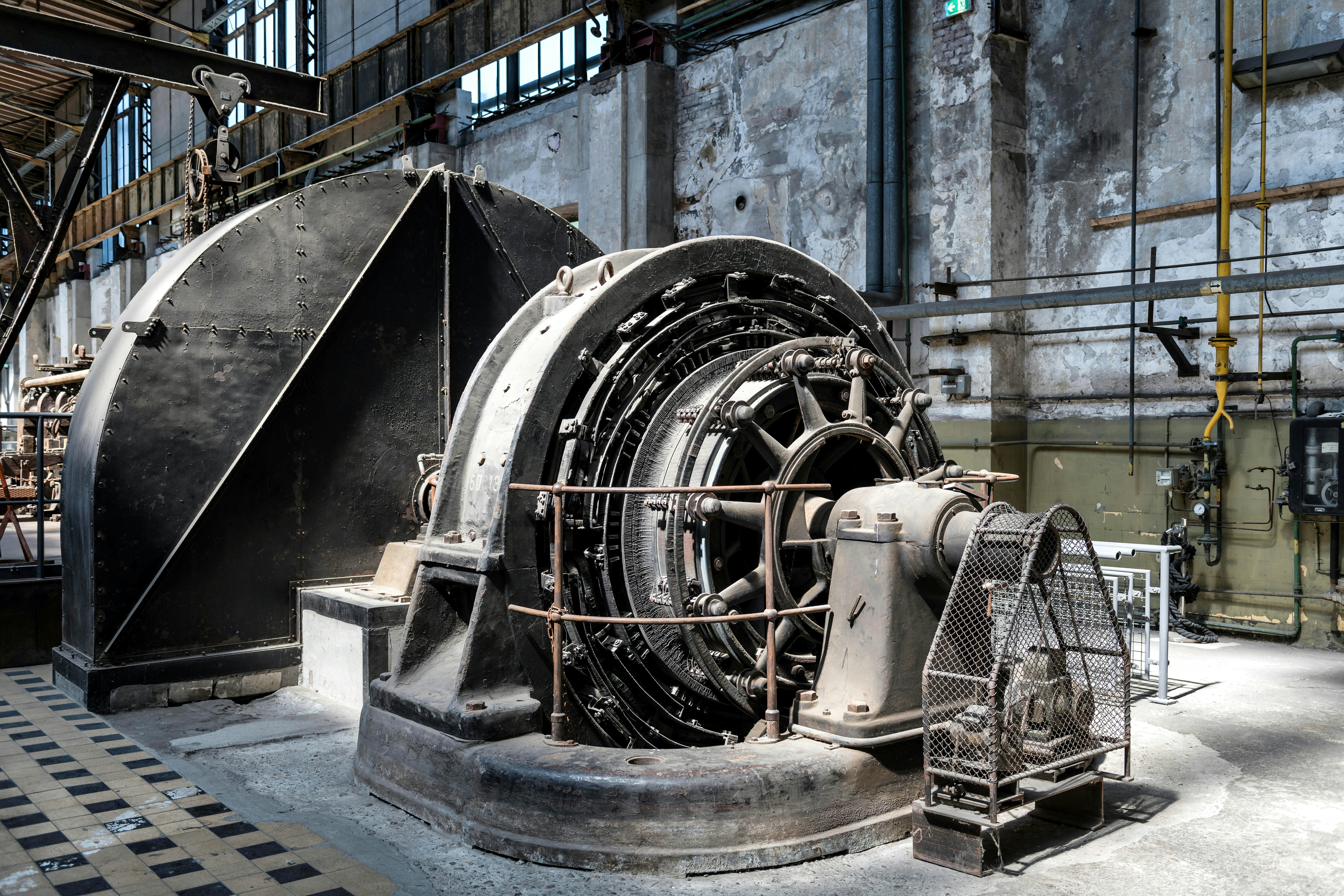 Industrial Dynamo: A Weathered Turbine in an Abandoned Plant