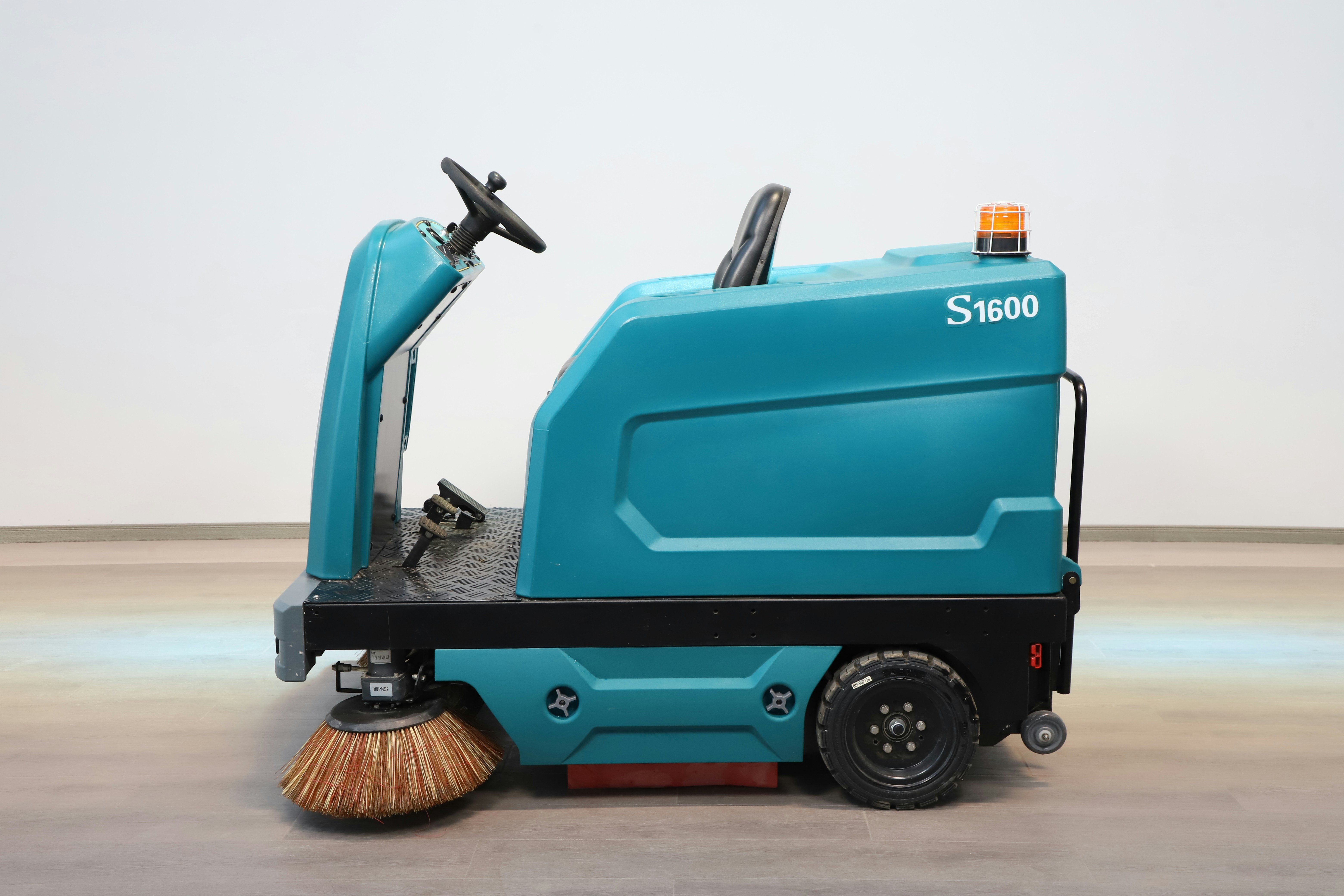Blue Swept-Sweeper on a Quiet Studio Floor