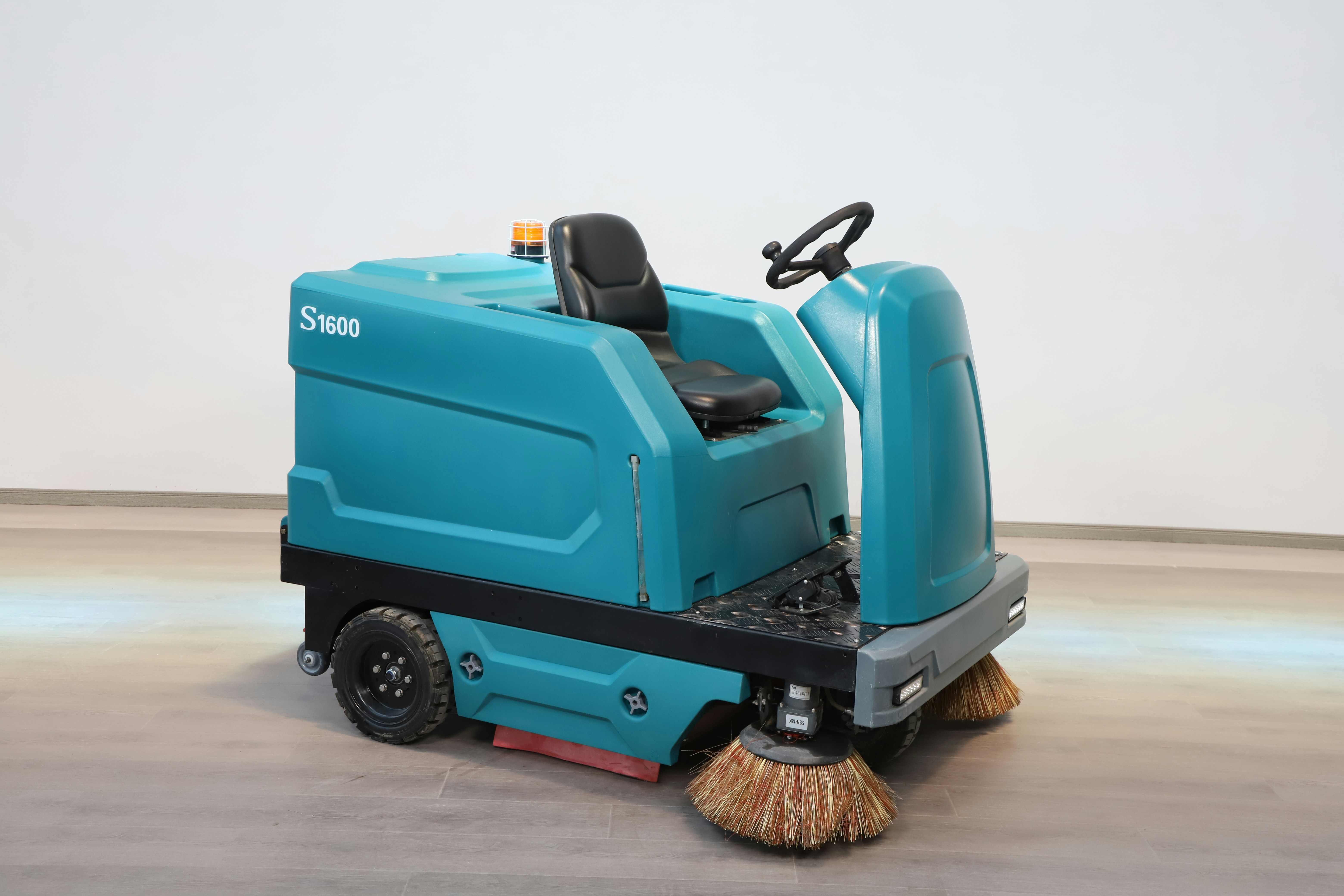 Teal Street Sweeper in a Minimal Studio