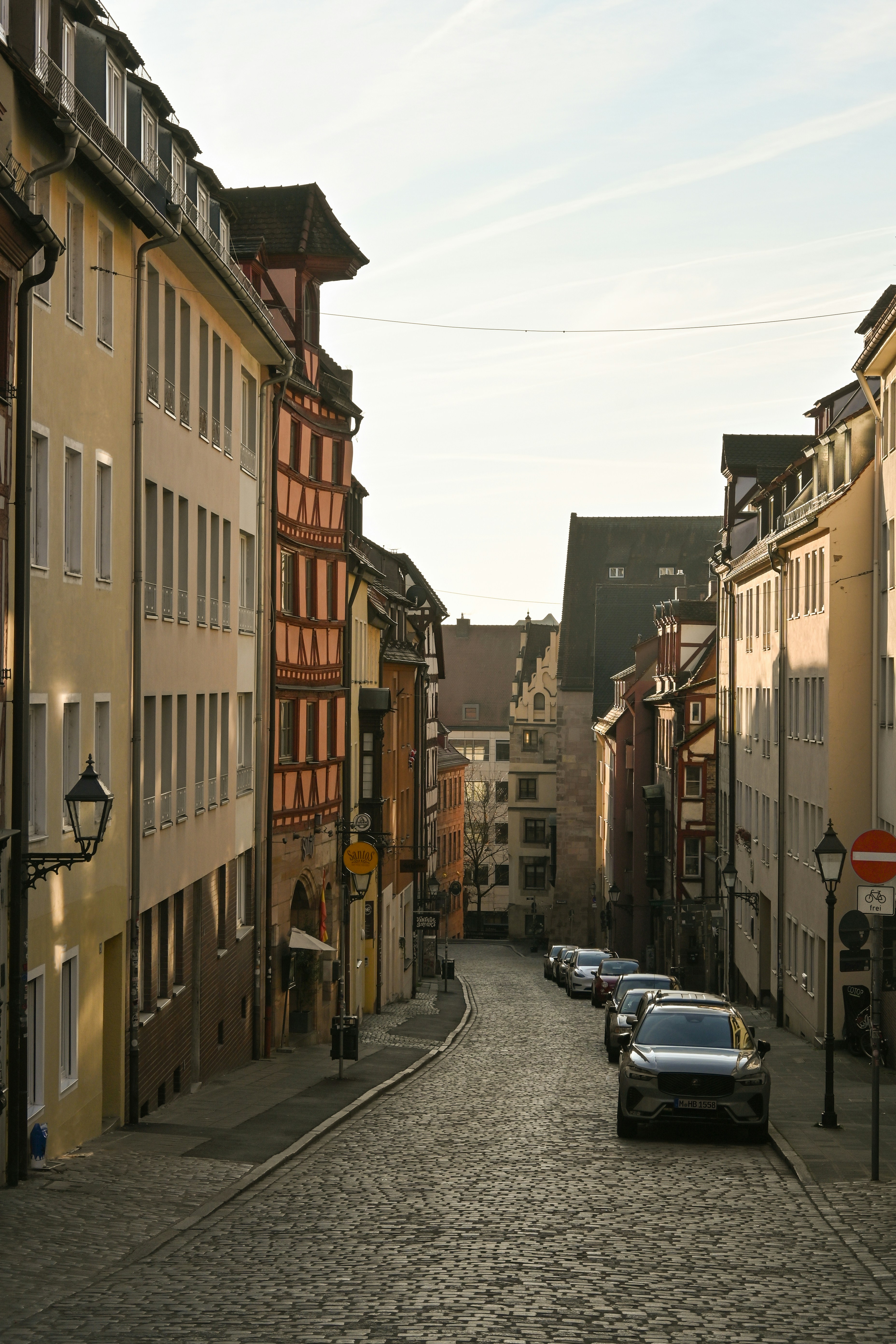 Cobbled Street Cascade: A Quiet European Lane Between Timeless Facades