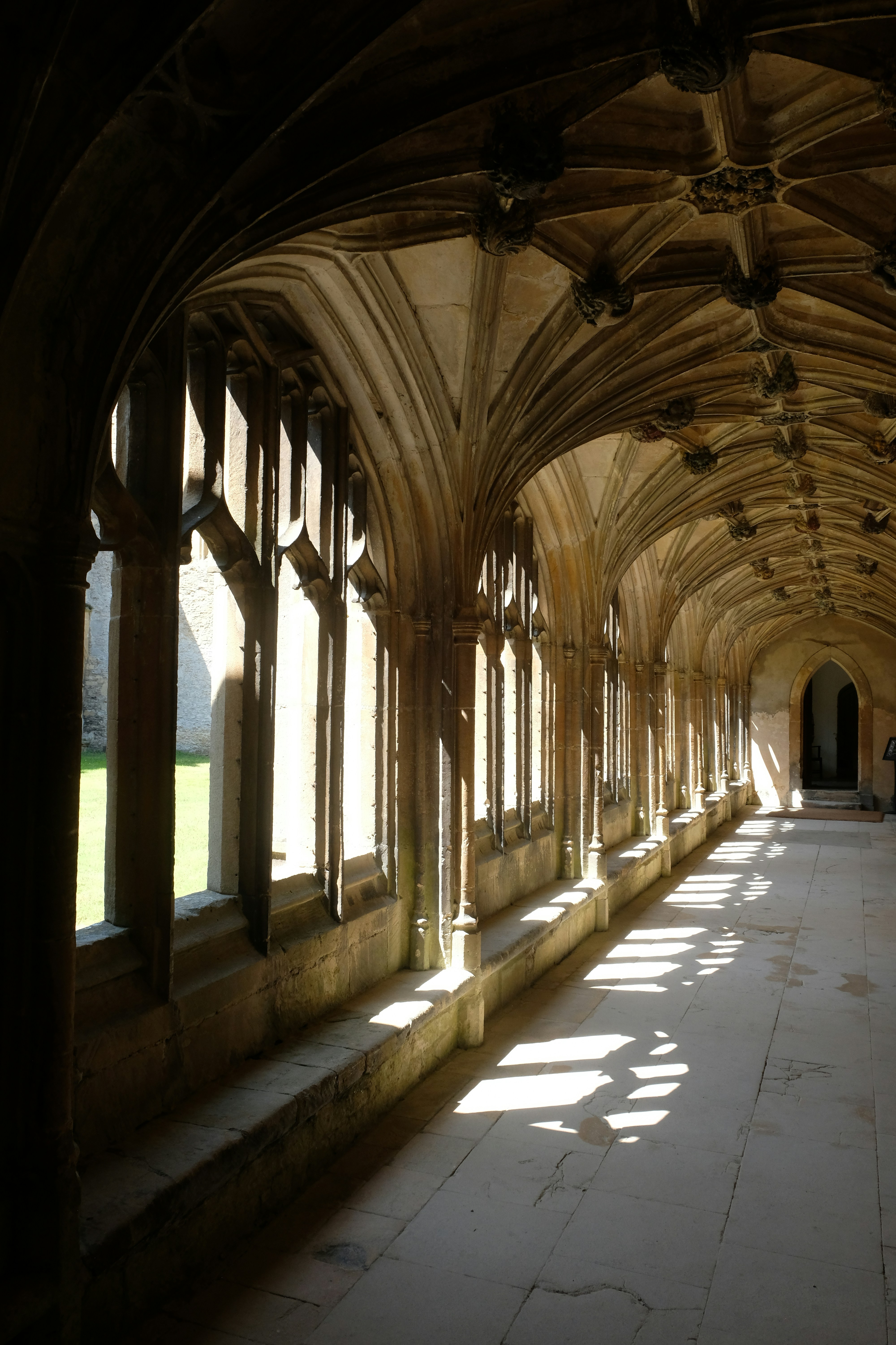 Stone Corridor of Light: Gothic Cloister in Morning Sun