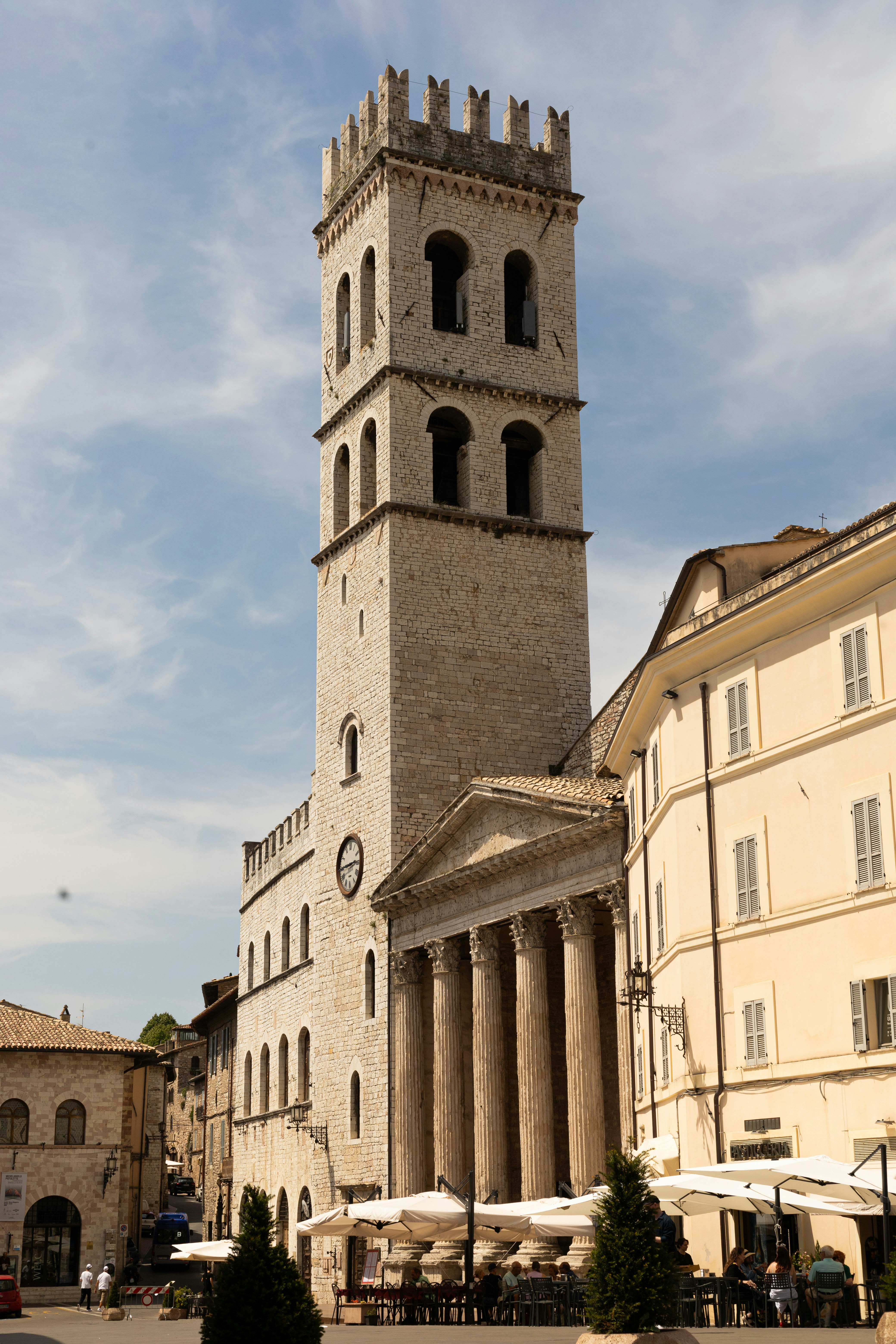 Bell Tower and Colonnade: A Sunlit Romanesque Corner
