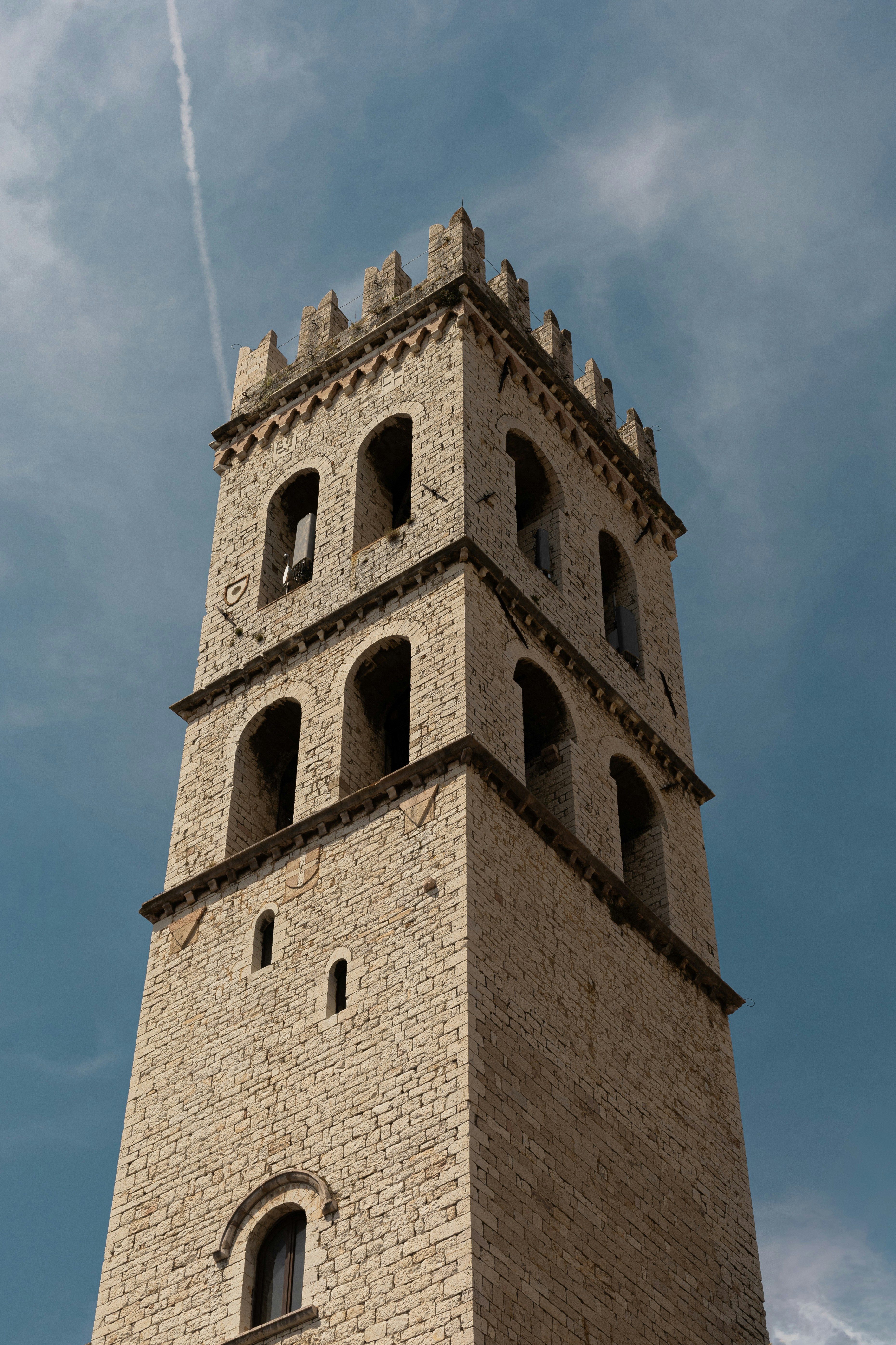Towering Stone Echoes: A Medieval Belfry Reaching Toward the Sky