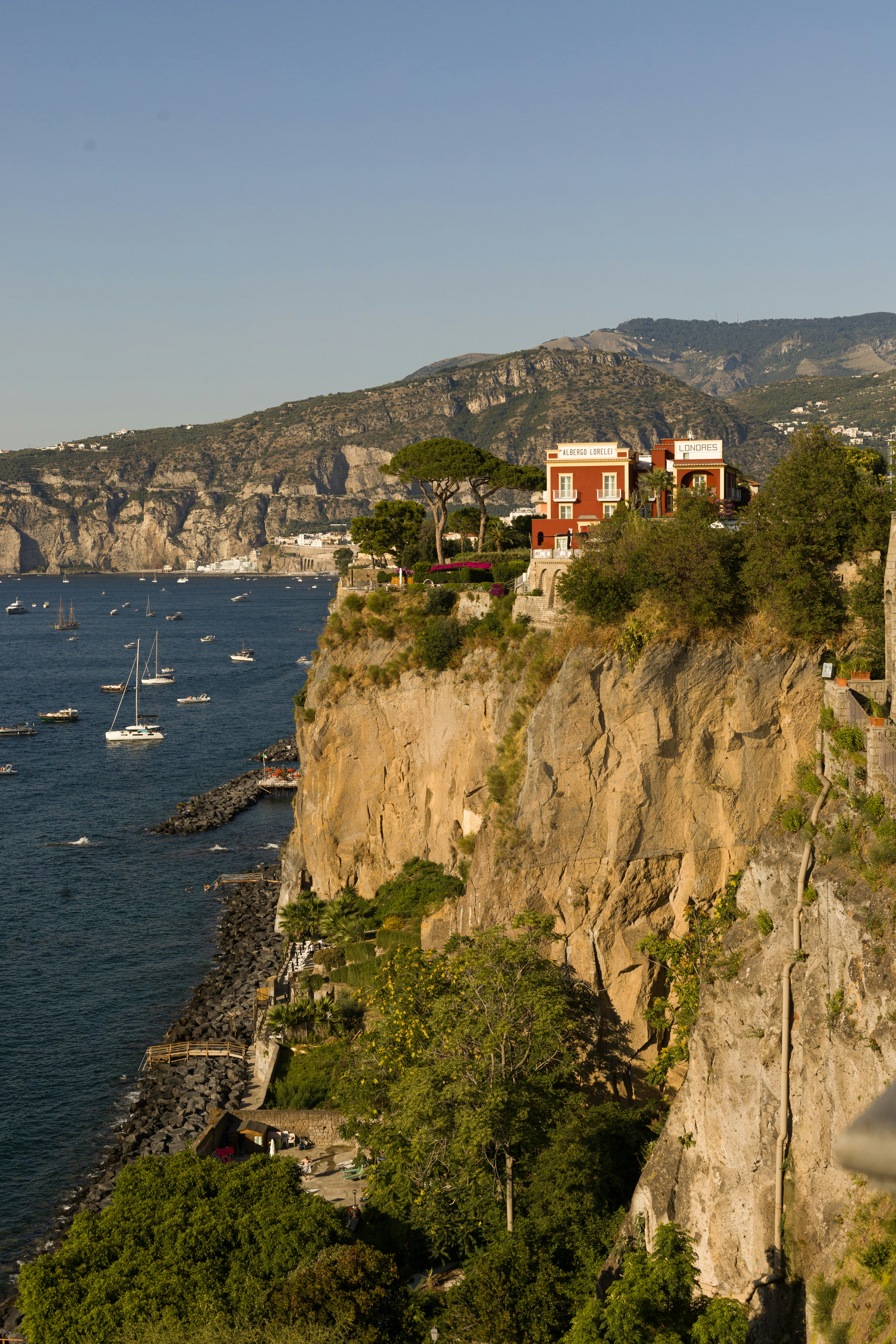  cliffsides and coastal villa: a sunlit retreat above the blue waters