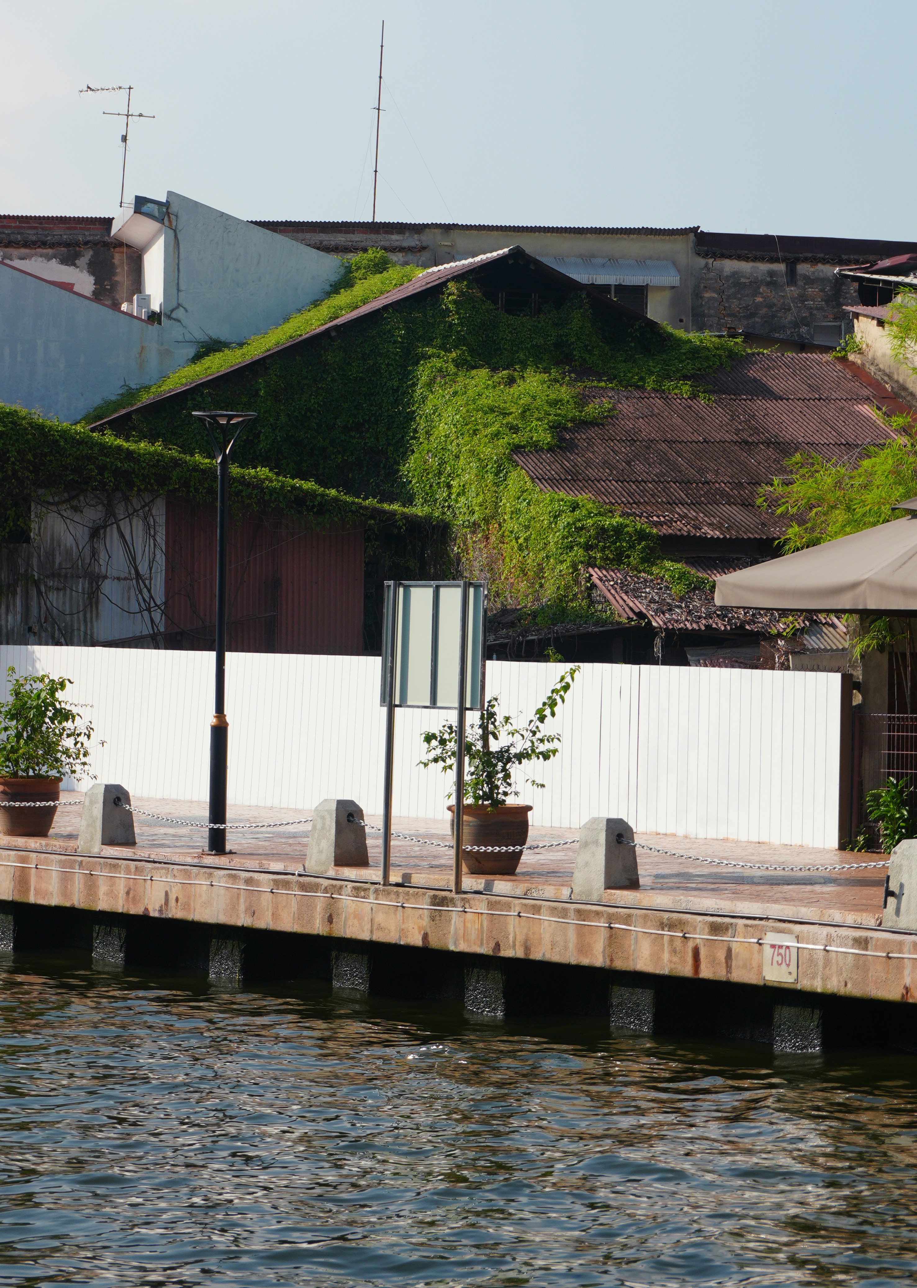 Warehouses by the Water: A Quiet Riverside Scene