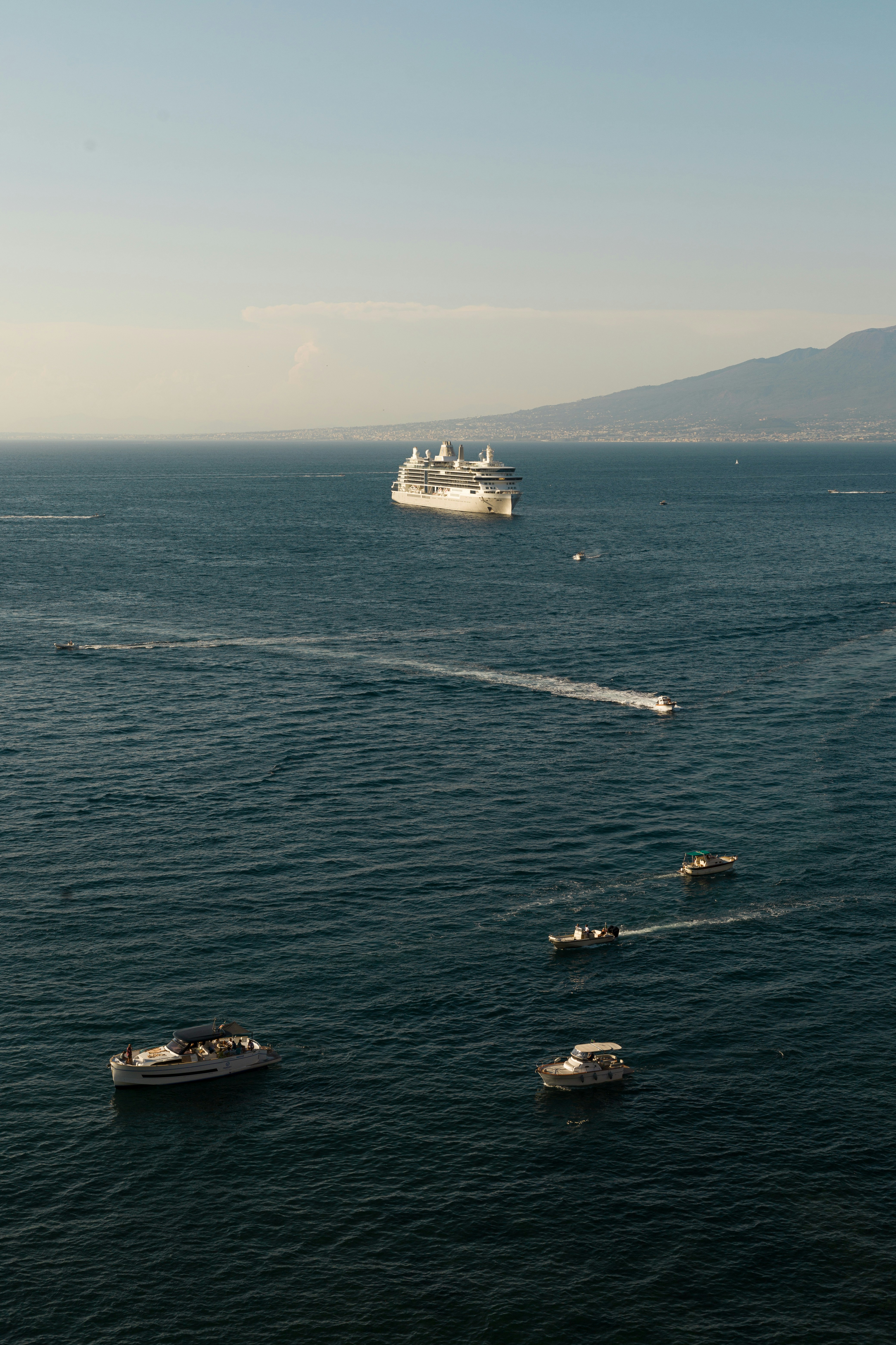Crossing Tide: A Fleet of Vessels Cascading toward the Horizon