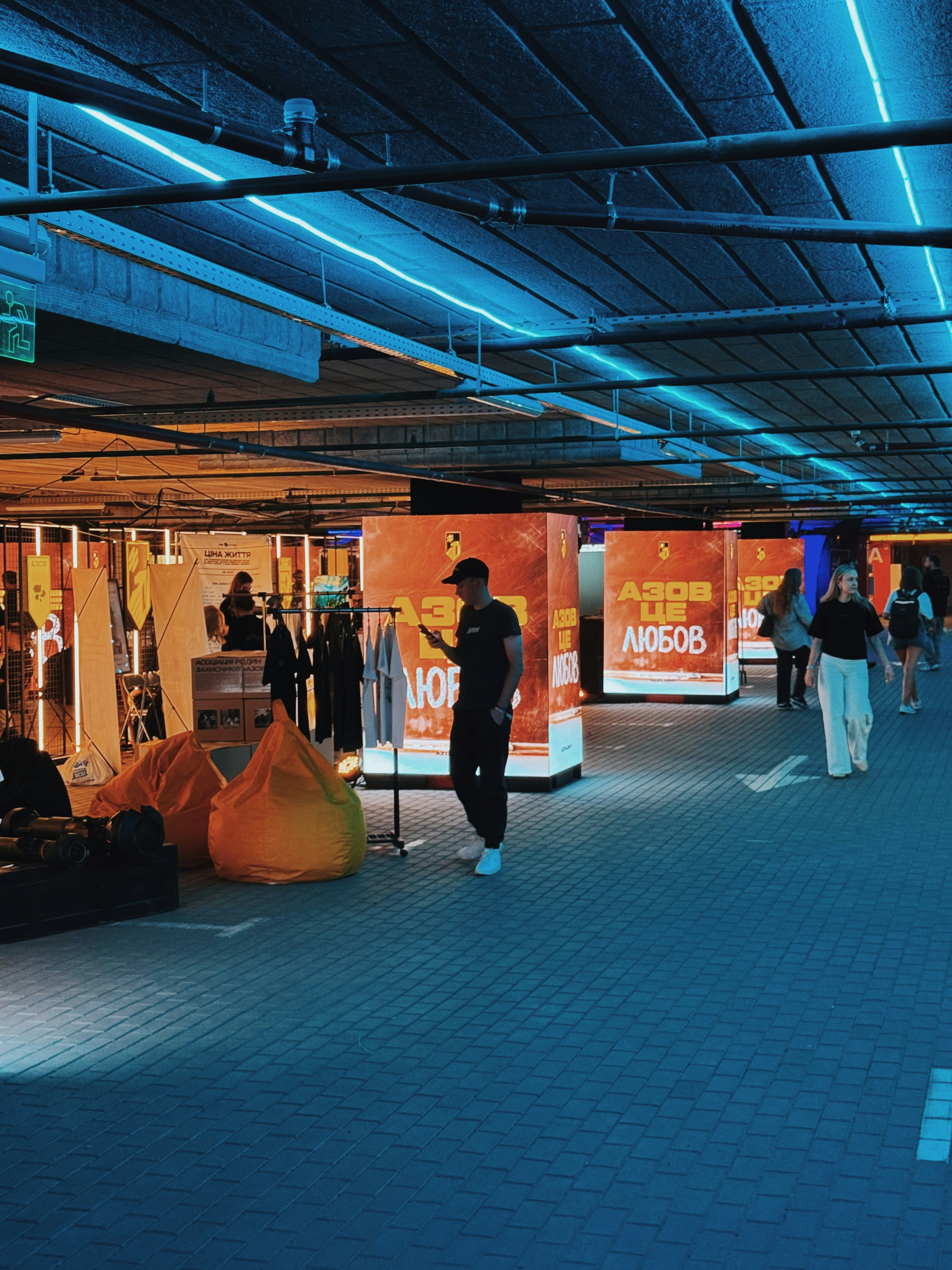 Under Neon Convergence: A Corridor of Warmth and Blue Light