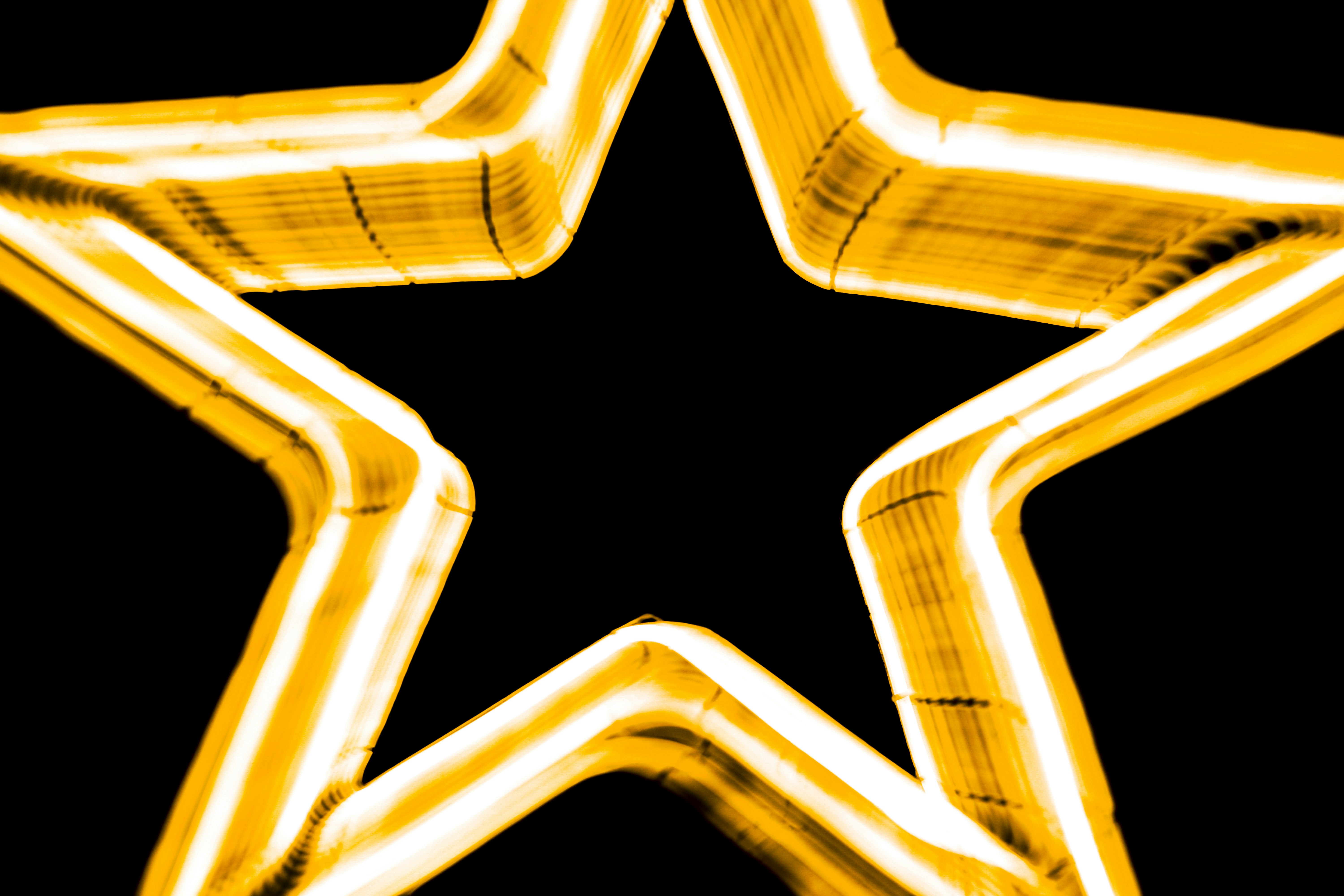 Gilded Star Frame Glowing Against Velvet Black