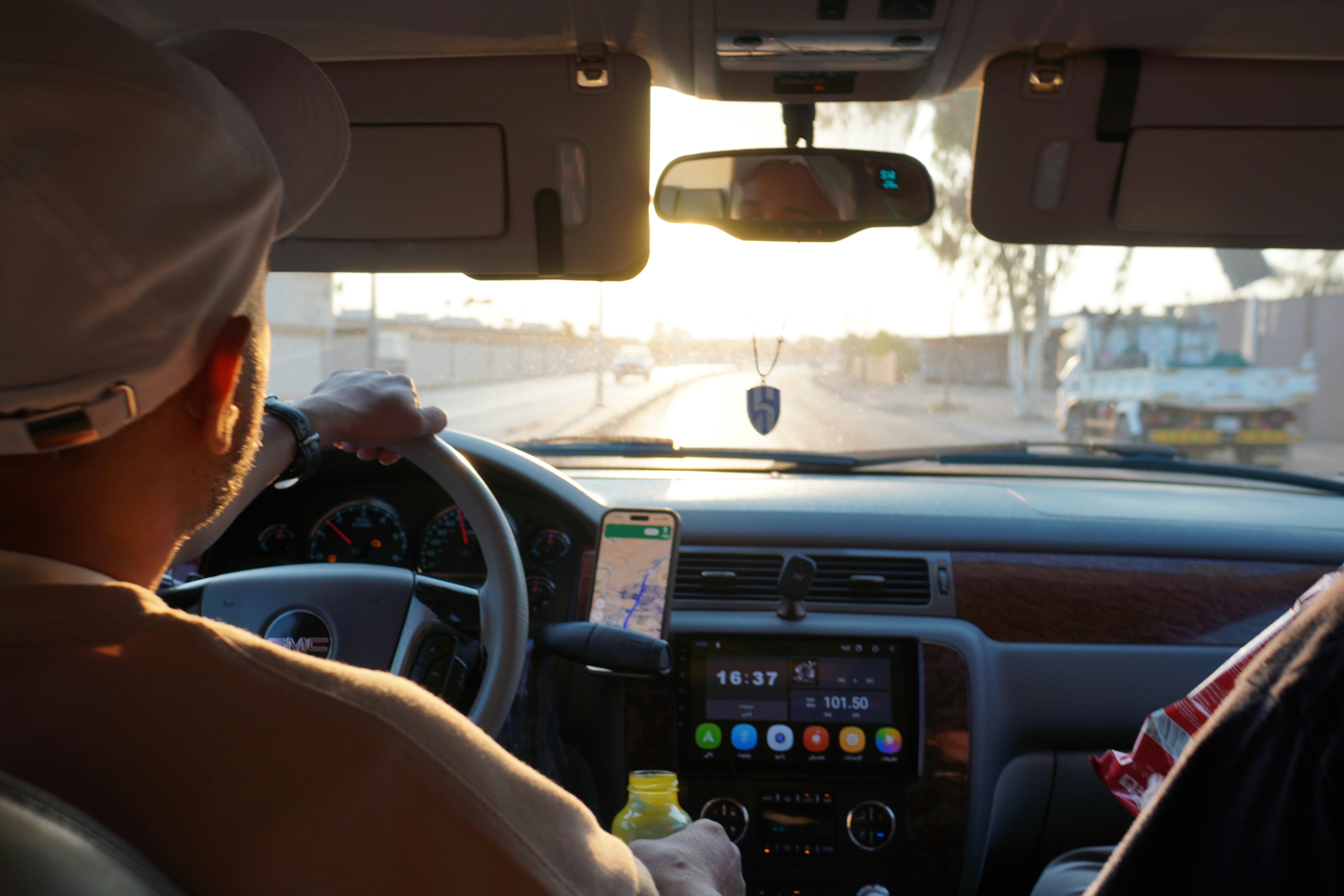Driver's Perspective: Sunset Drive Through a Car Dashboard