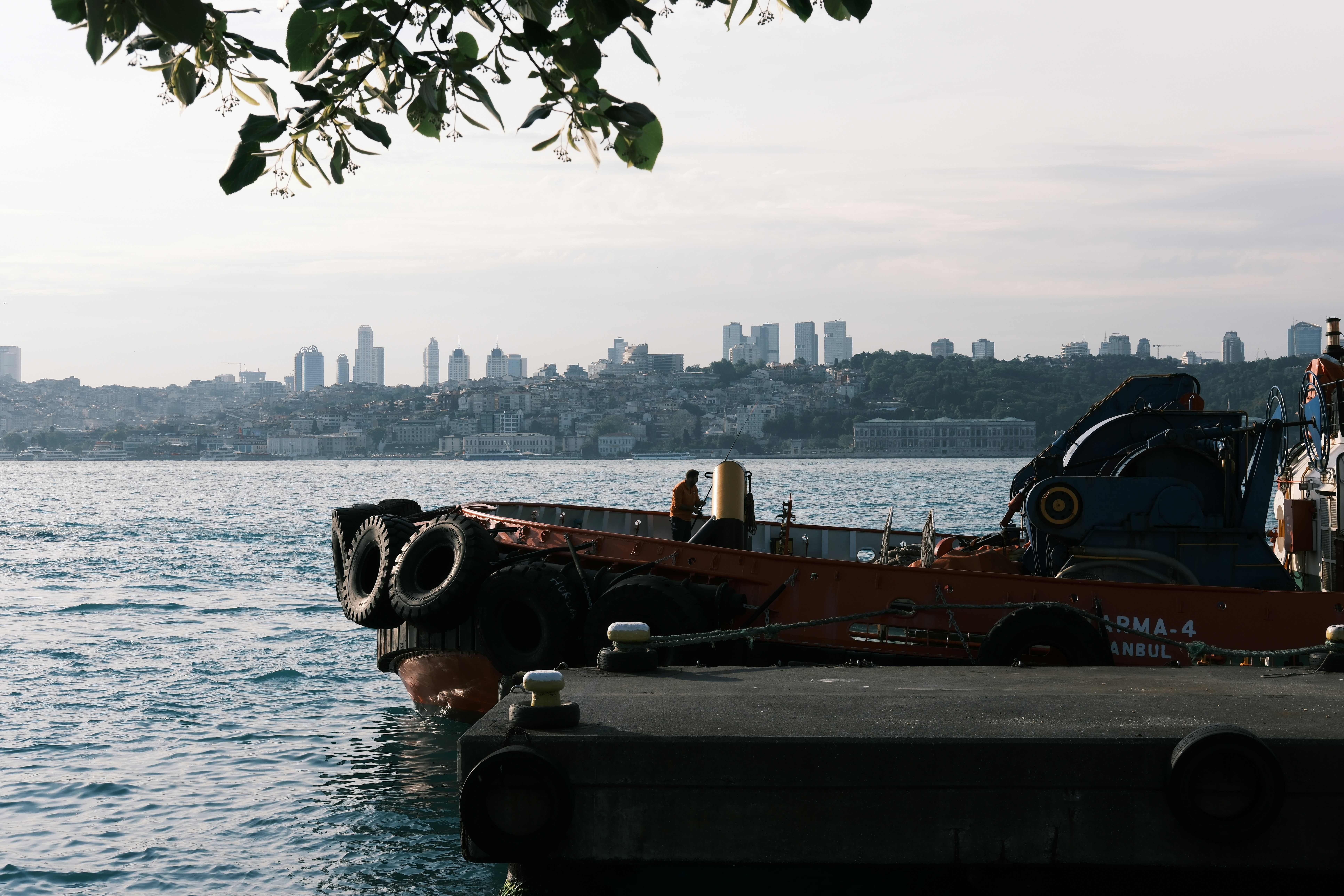 Harbor Yet Quiet: Tugboats at the Dock with Cityscape Beyond