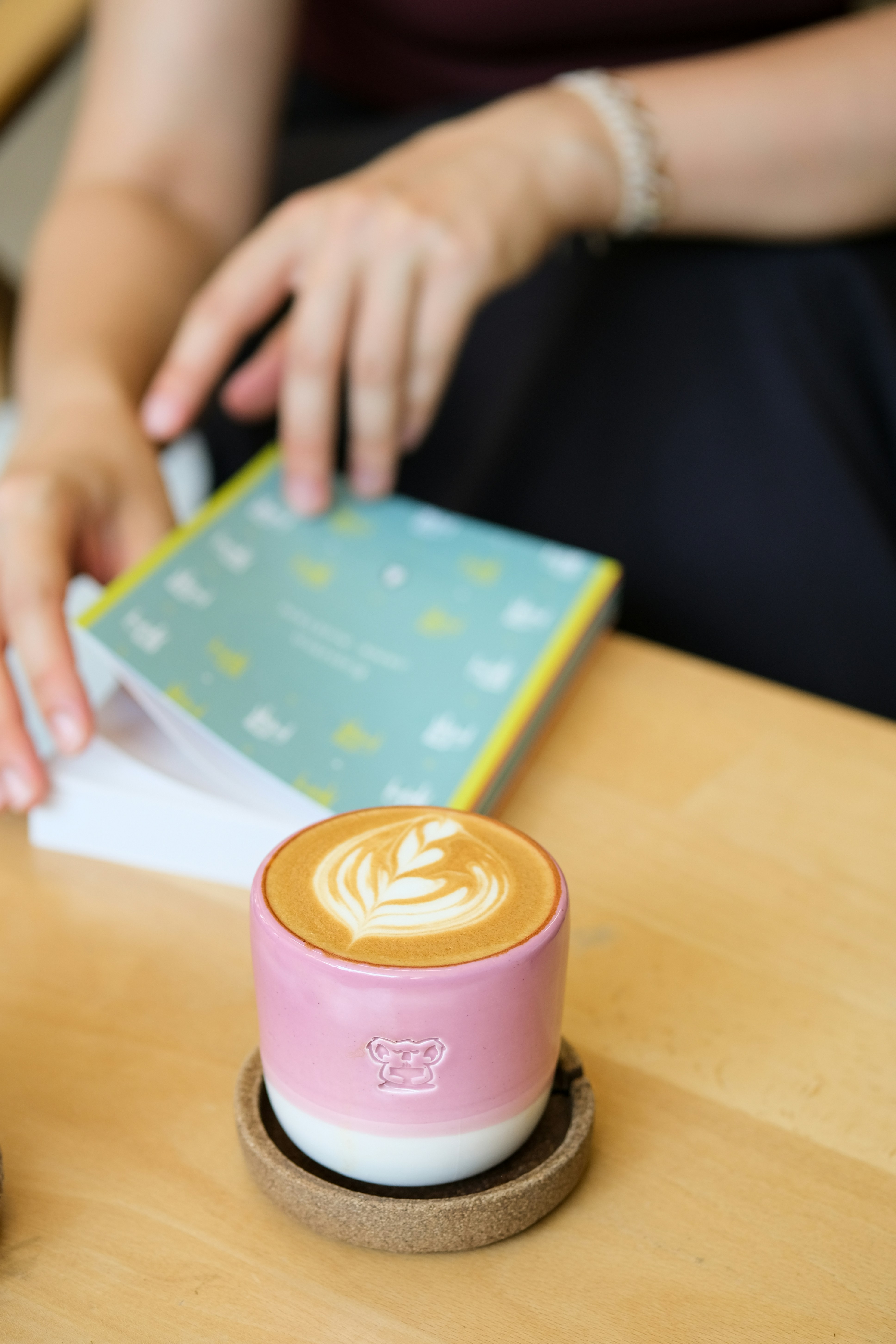 Pink Cappuccino and a Quiet Moment with a Book
