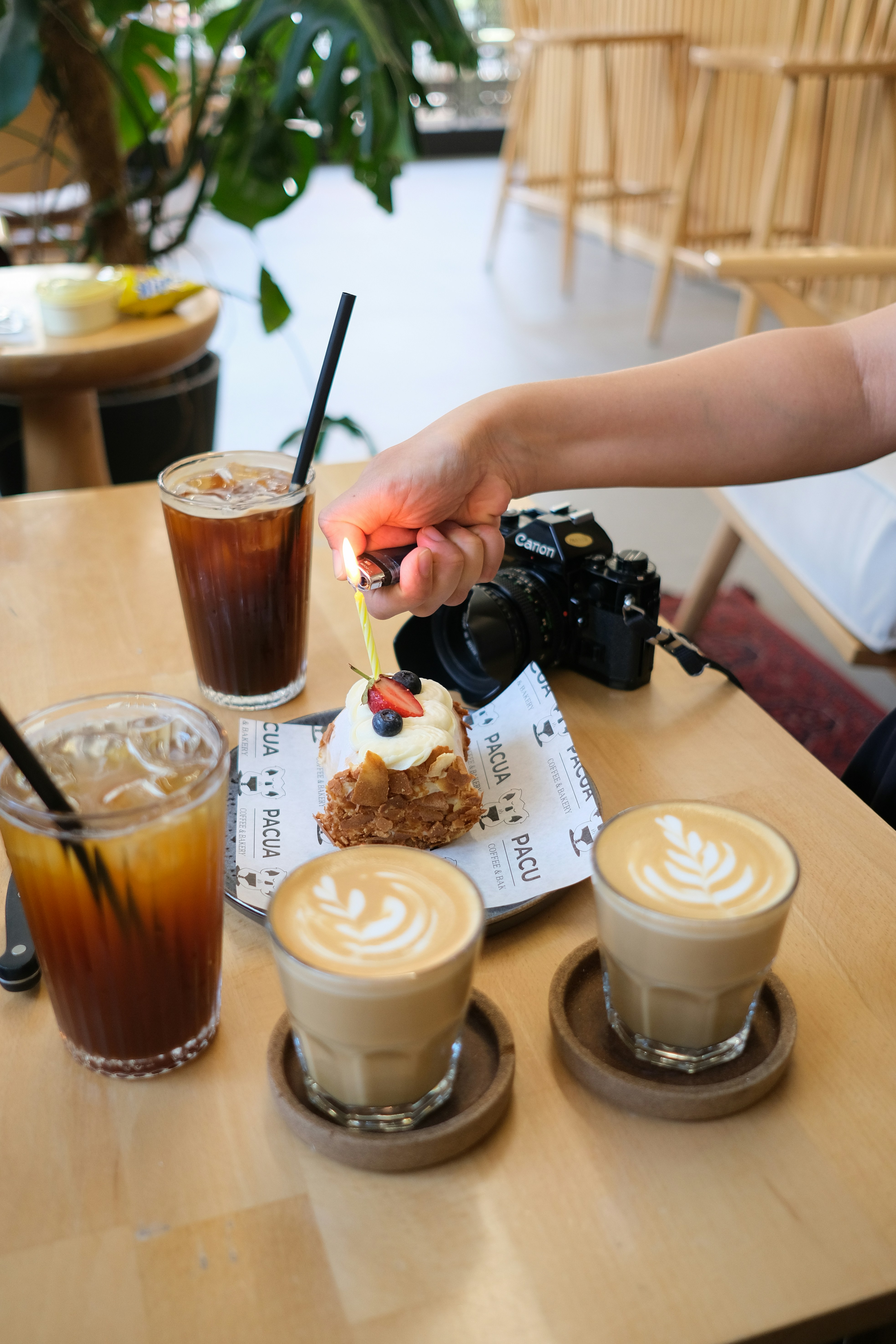 Caffeinated Craft: A Barista's Gilded Moment with a Lens Nearby