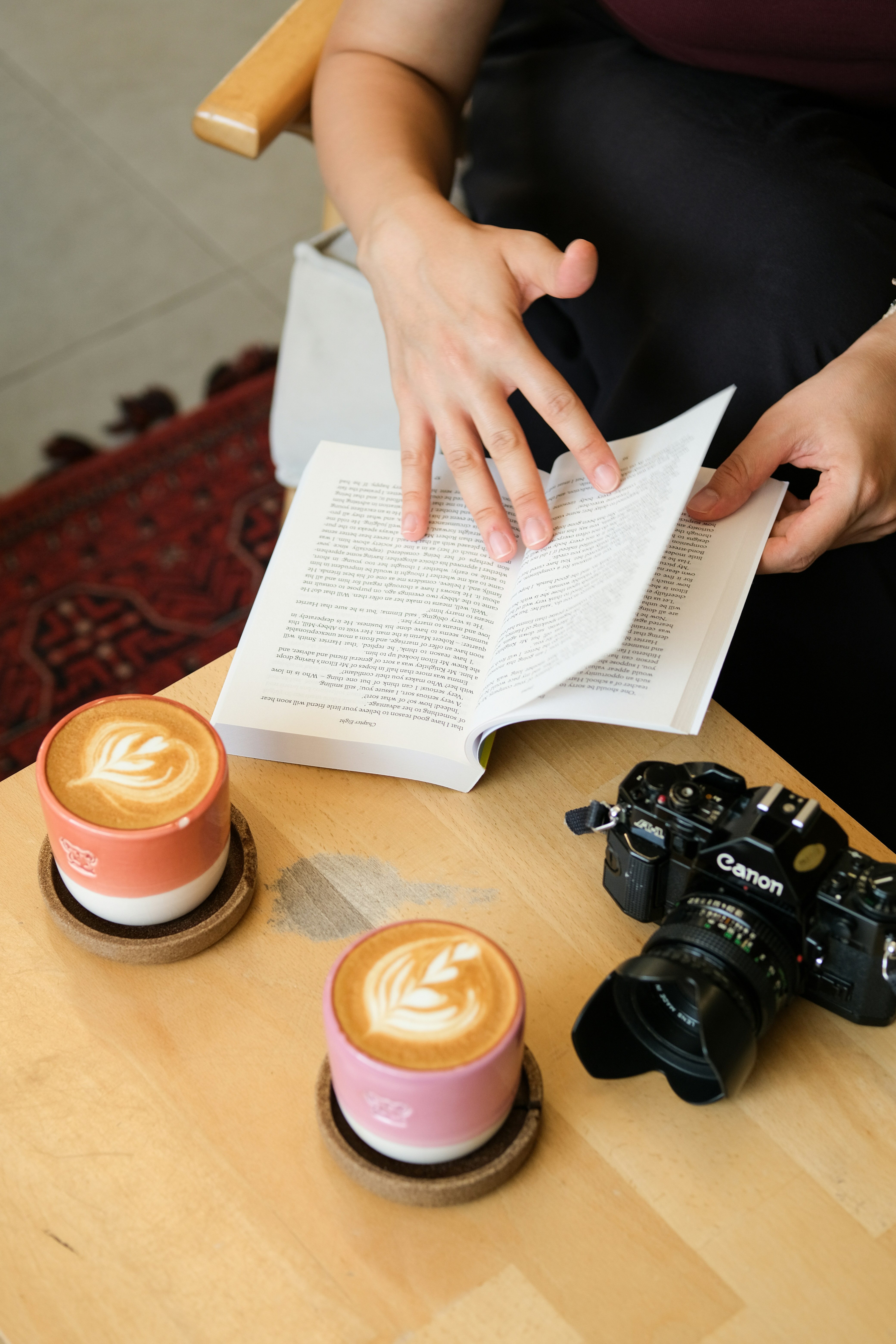 Quiet Focus: A Reader and a Camera on a Coffee Break
