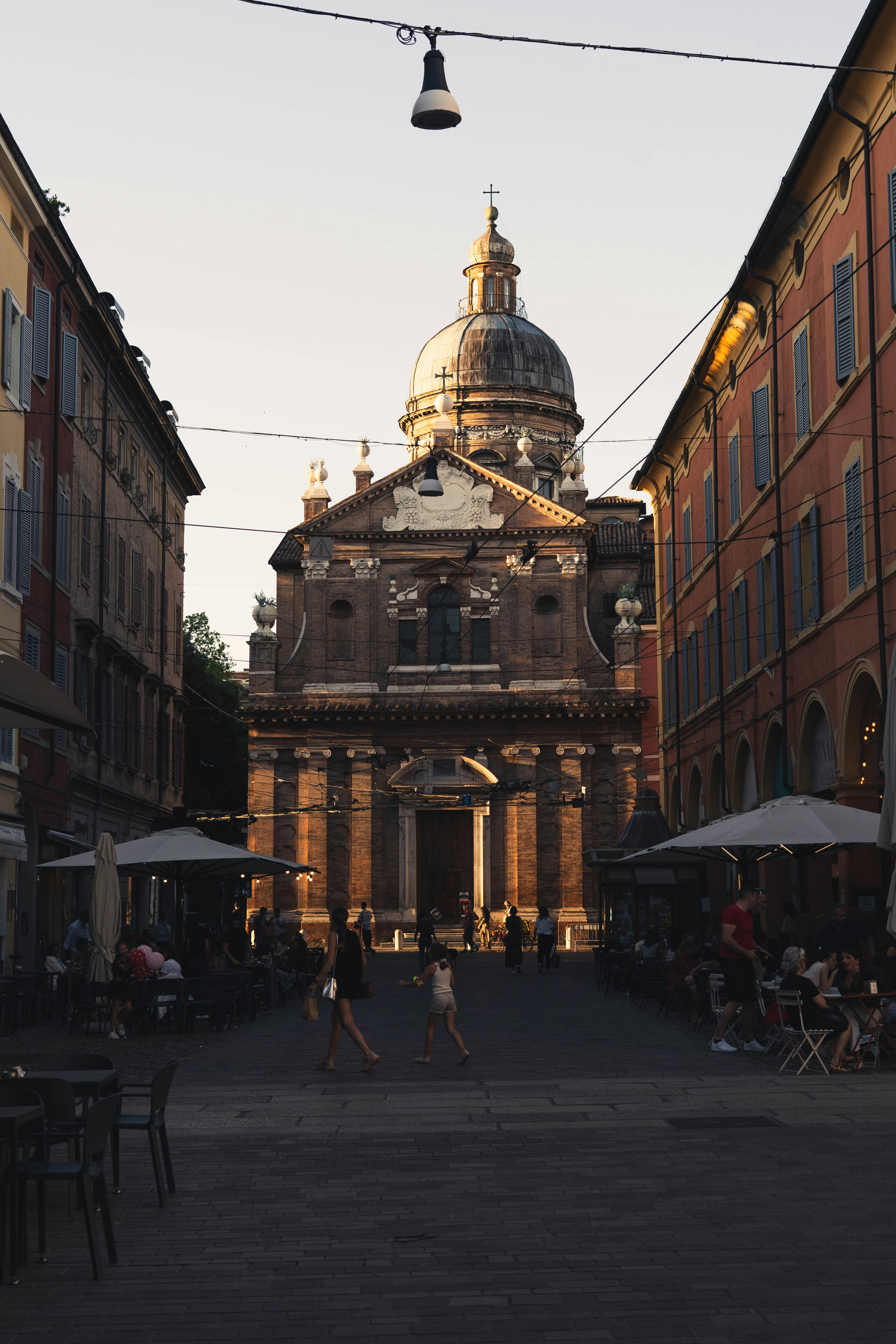 Cathedral Gate: Sunset Glow in a Narrow Italian Street