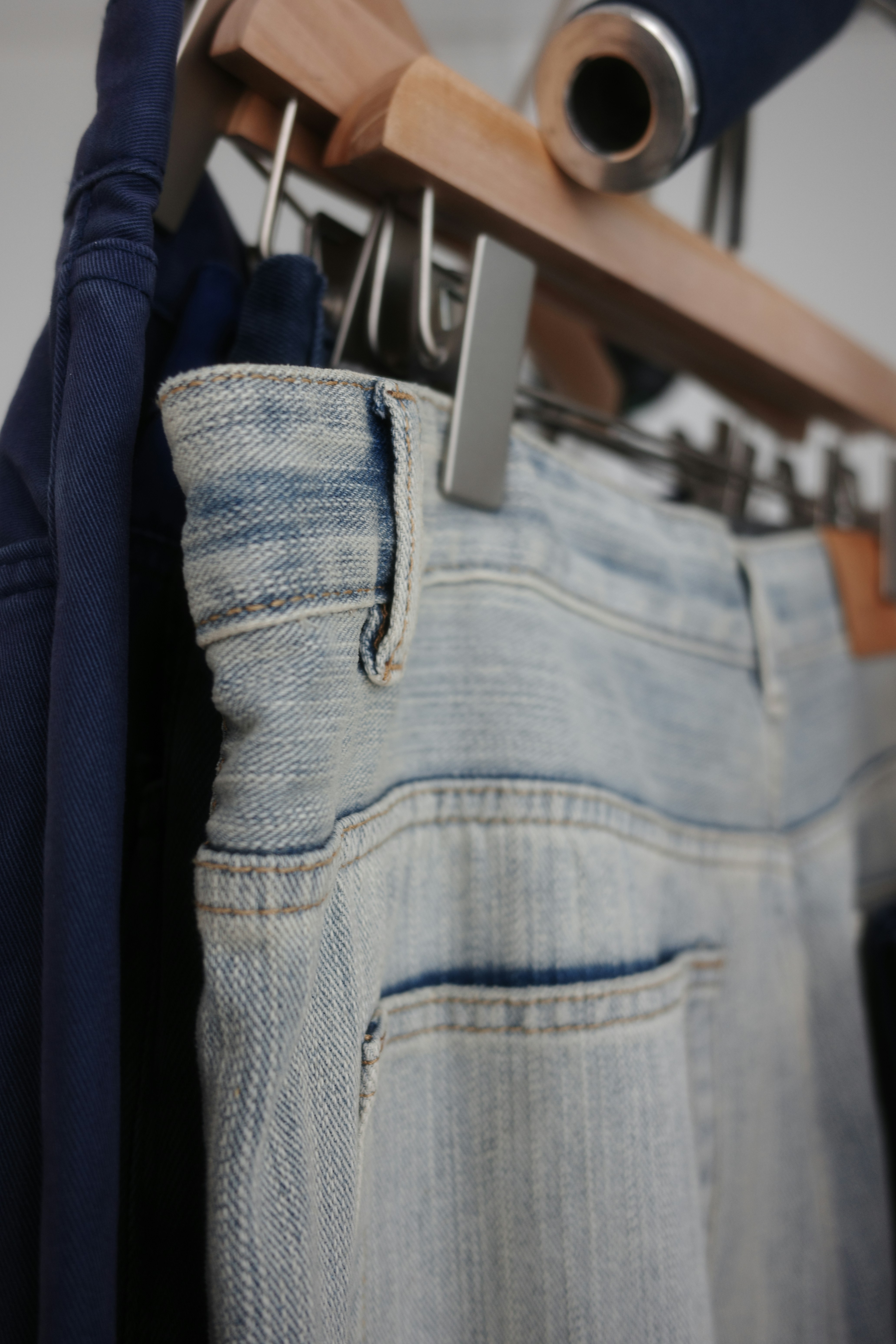 Denim in Focus: Jeans on a Wood and Metal Rack