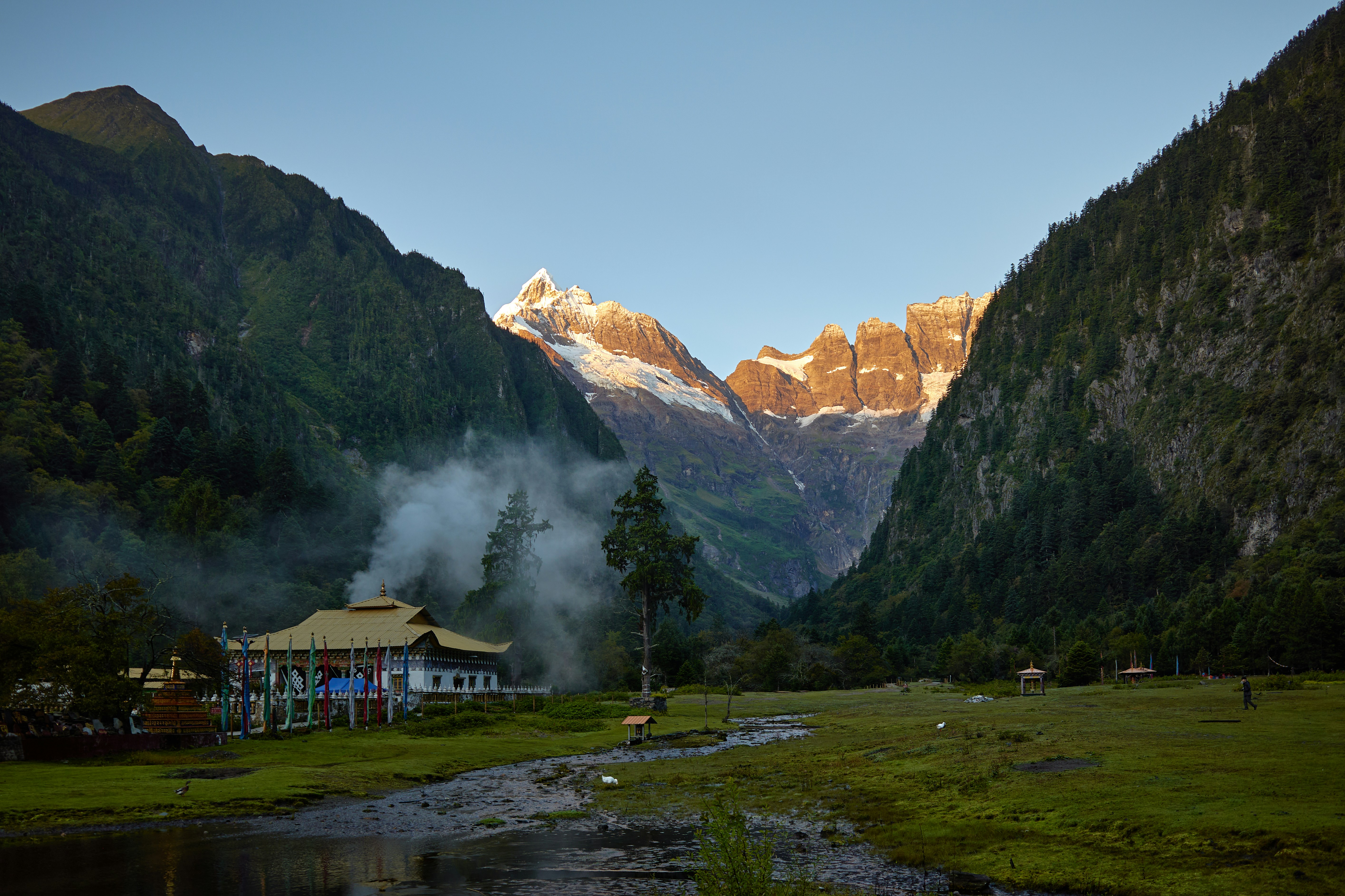 Golden Peaks Over a Quiet Valley Temple
