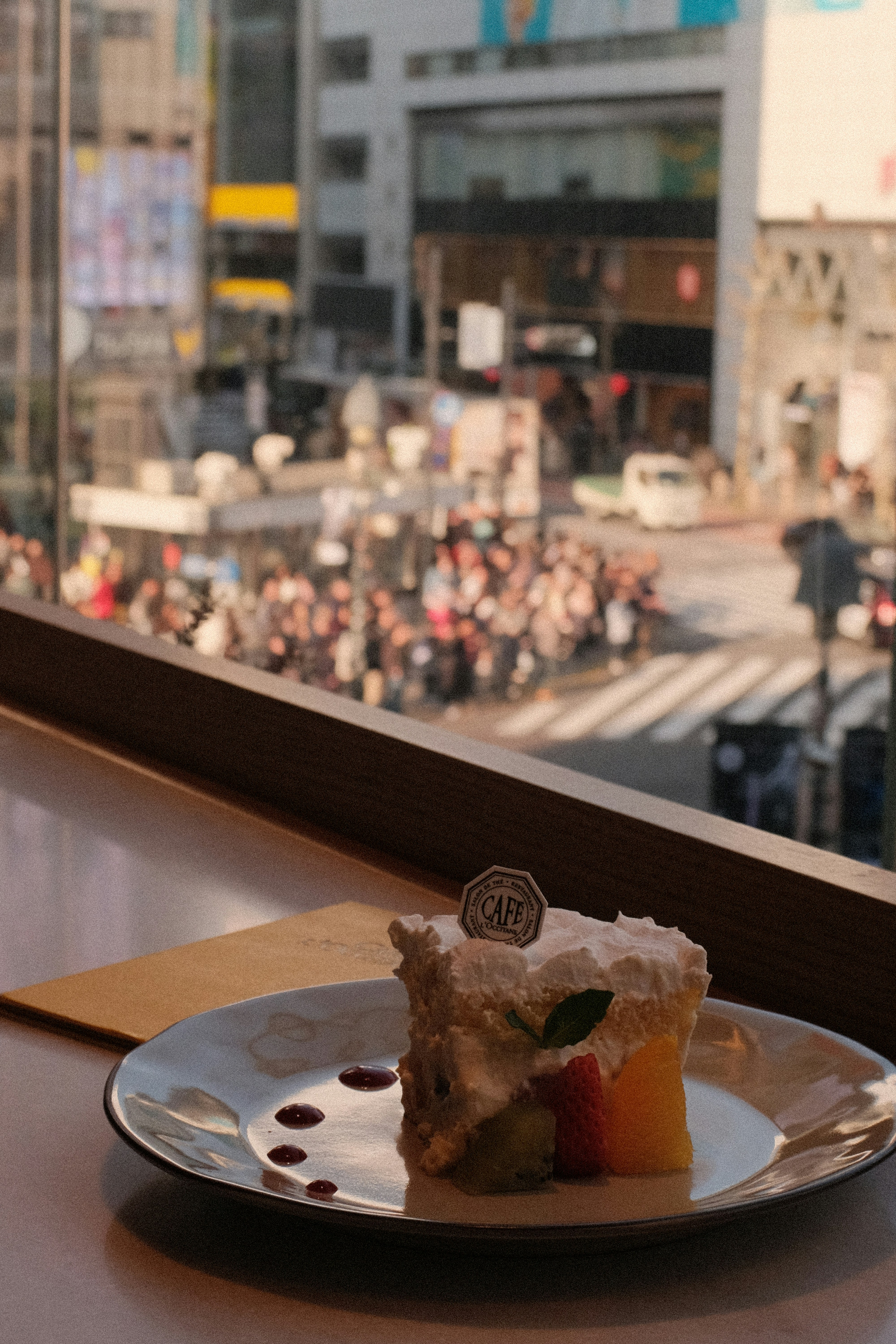 Slice of City Café: Fruit Cake with a Street Scene Backdrop