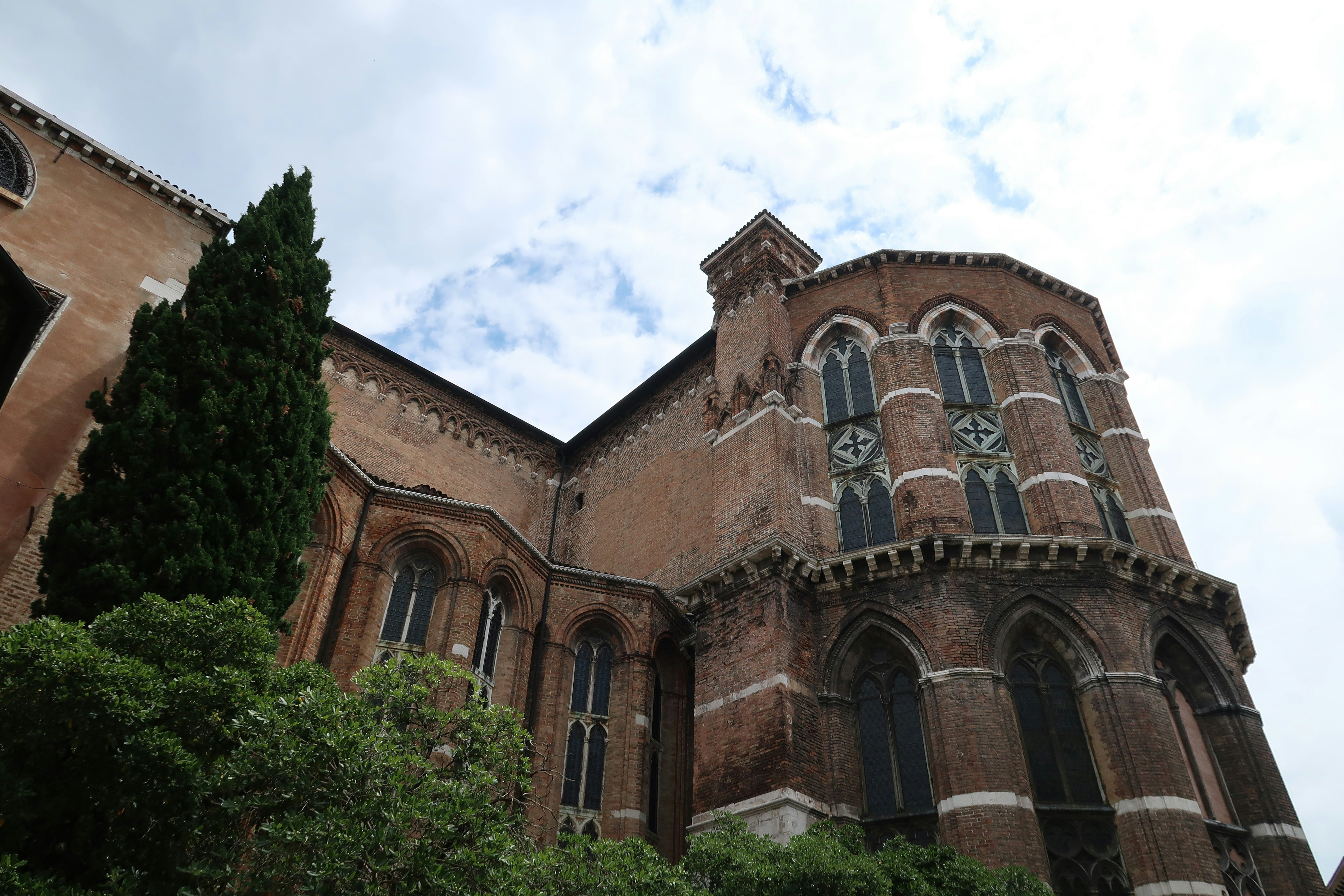 Brick Gothic Facade Reaching Toward a Brighter Sky