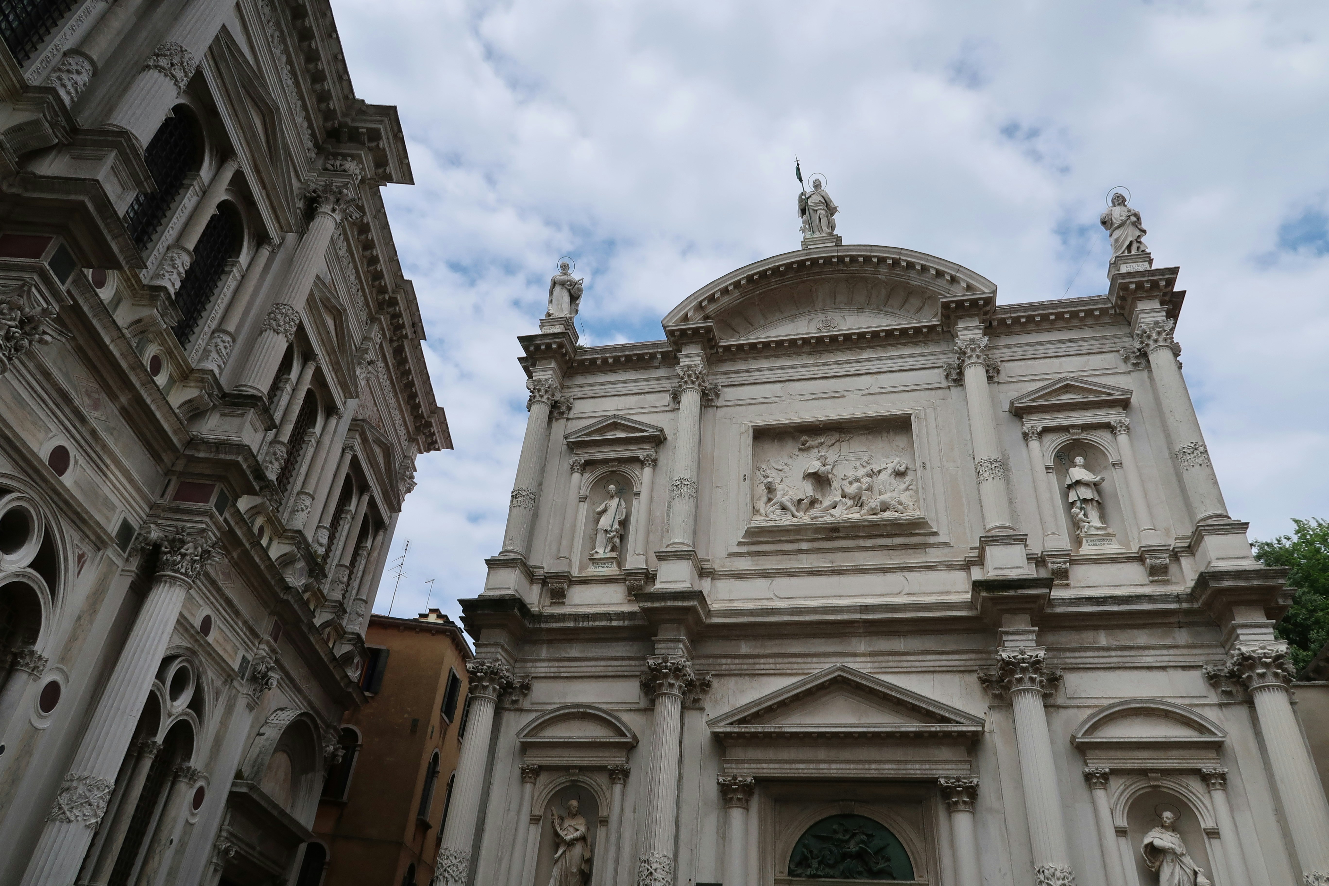Stone Facade Symphony: Classical Architecture Framed by Aerial Sky
