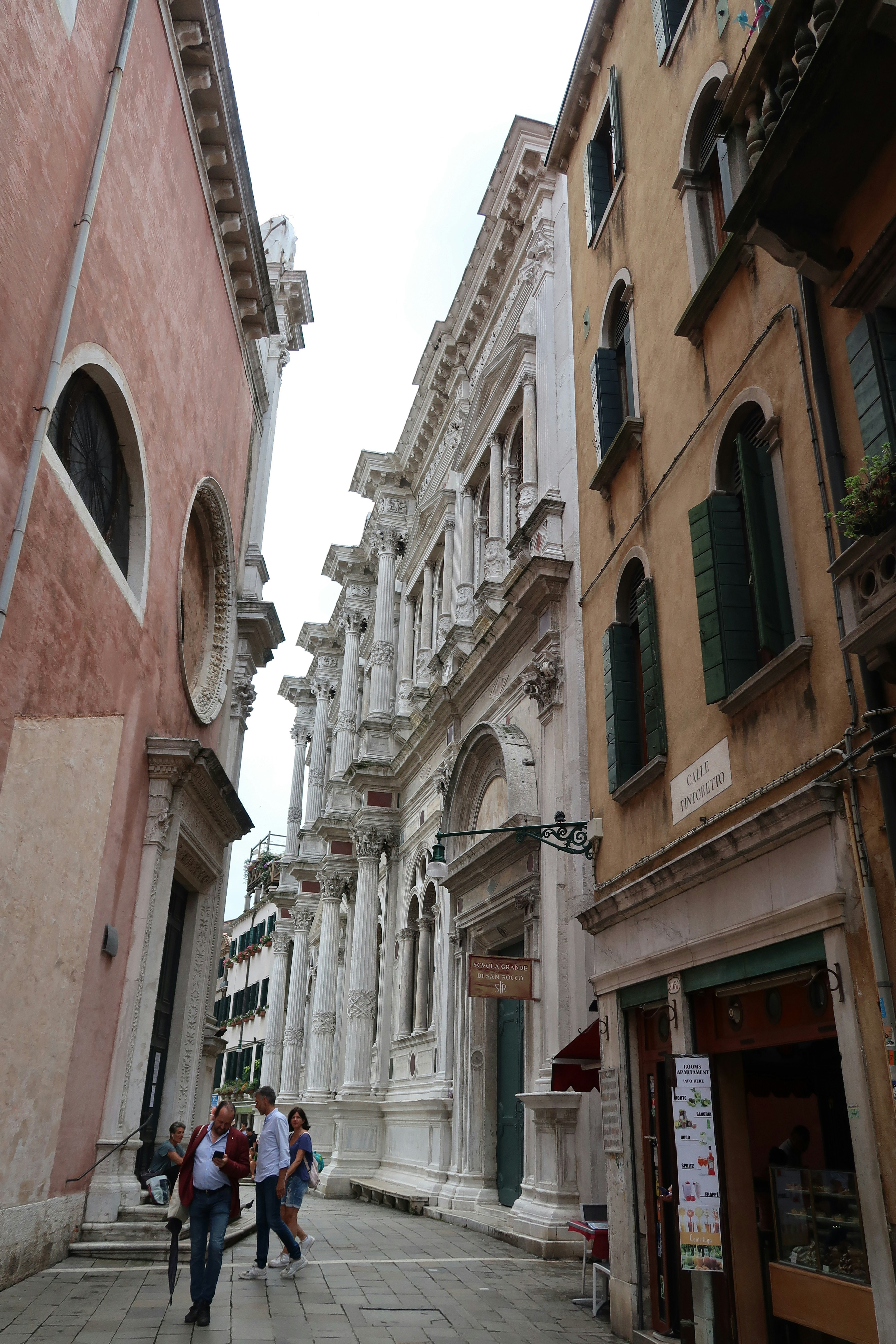 Narrow Venetian Streetway Framed by Ornate Facades