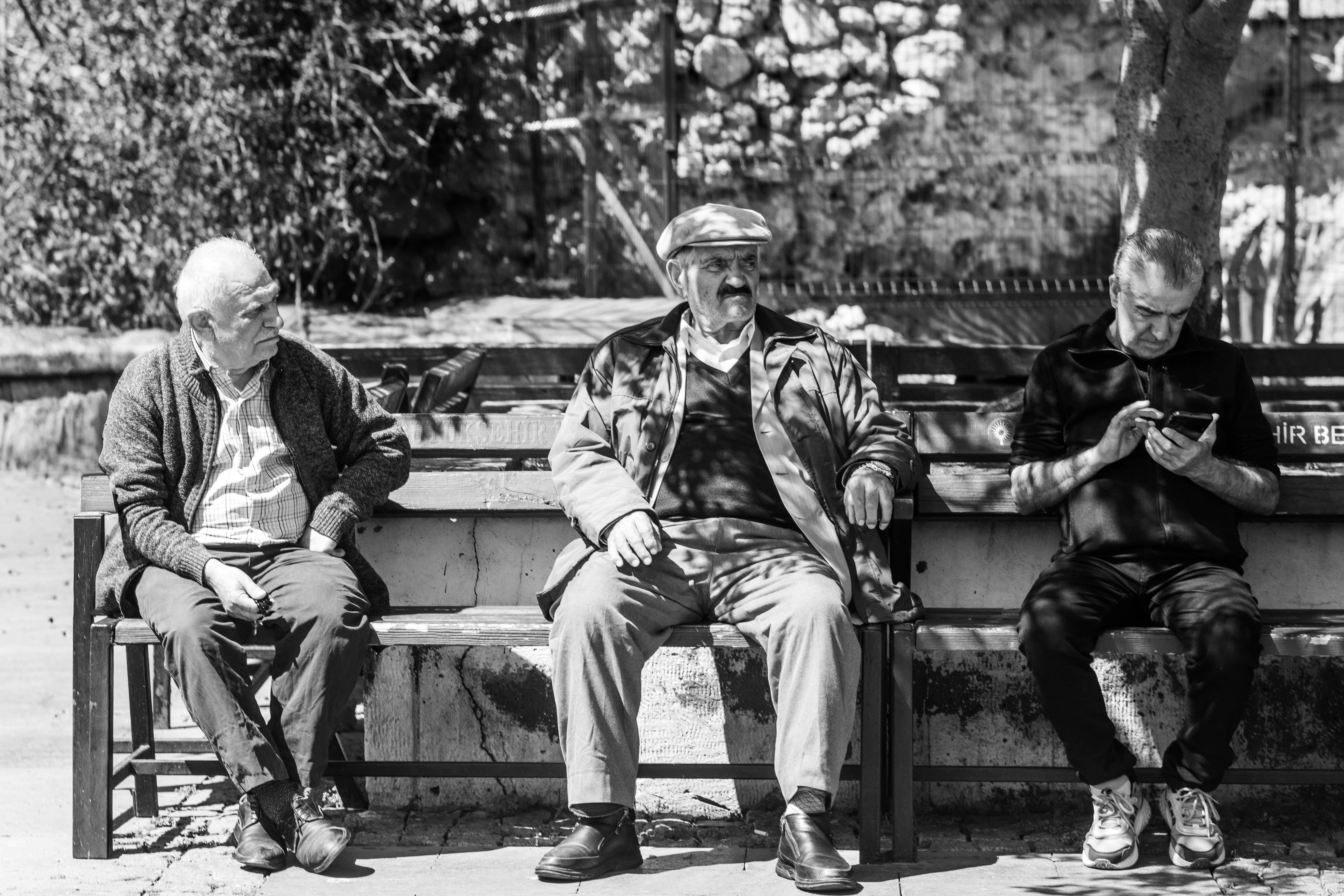 Three Generations on a Park Bench: Still Moments in Monochrome