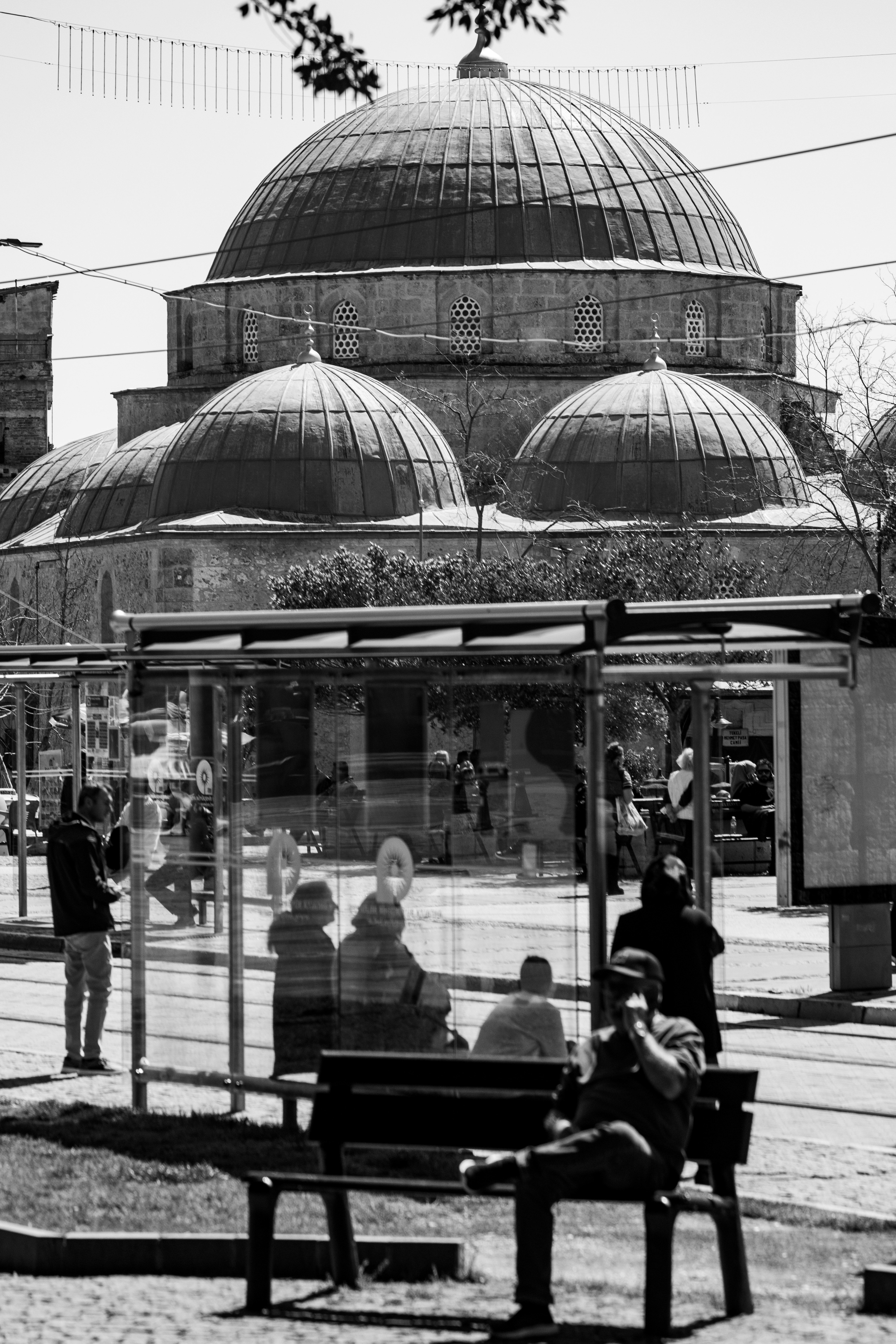Dome Streetside: Quiet Bus Shelter Beneath Historic Silhouettes