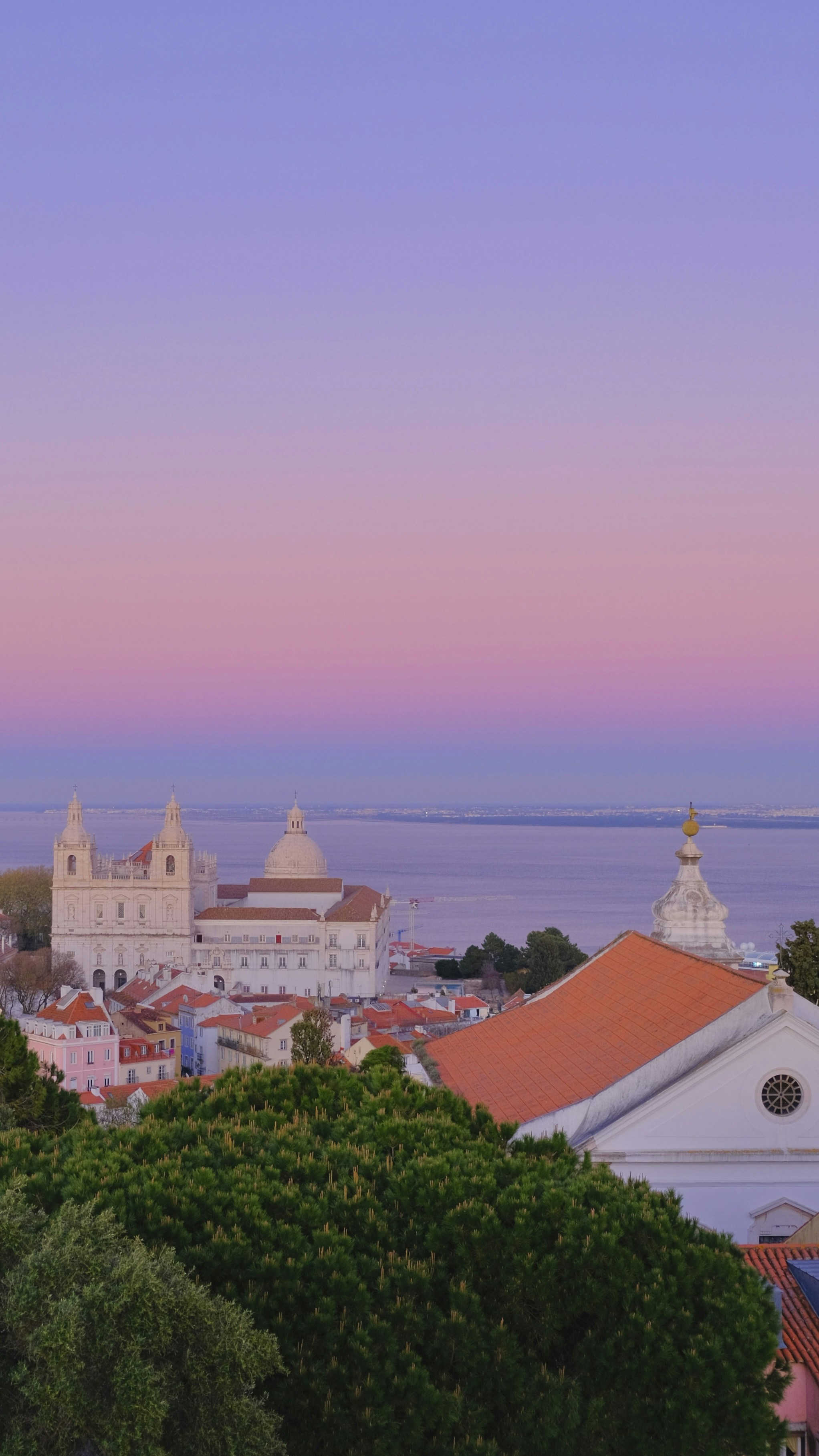 Pastel Horizon Over Lisbon Rooftops