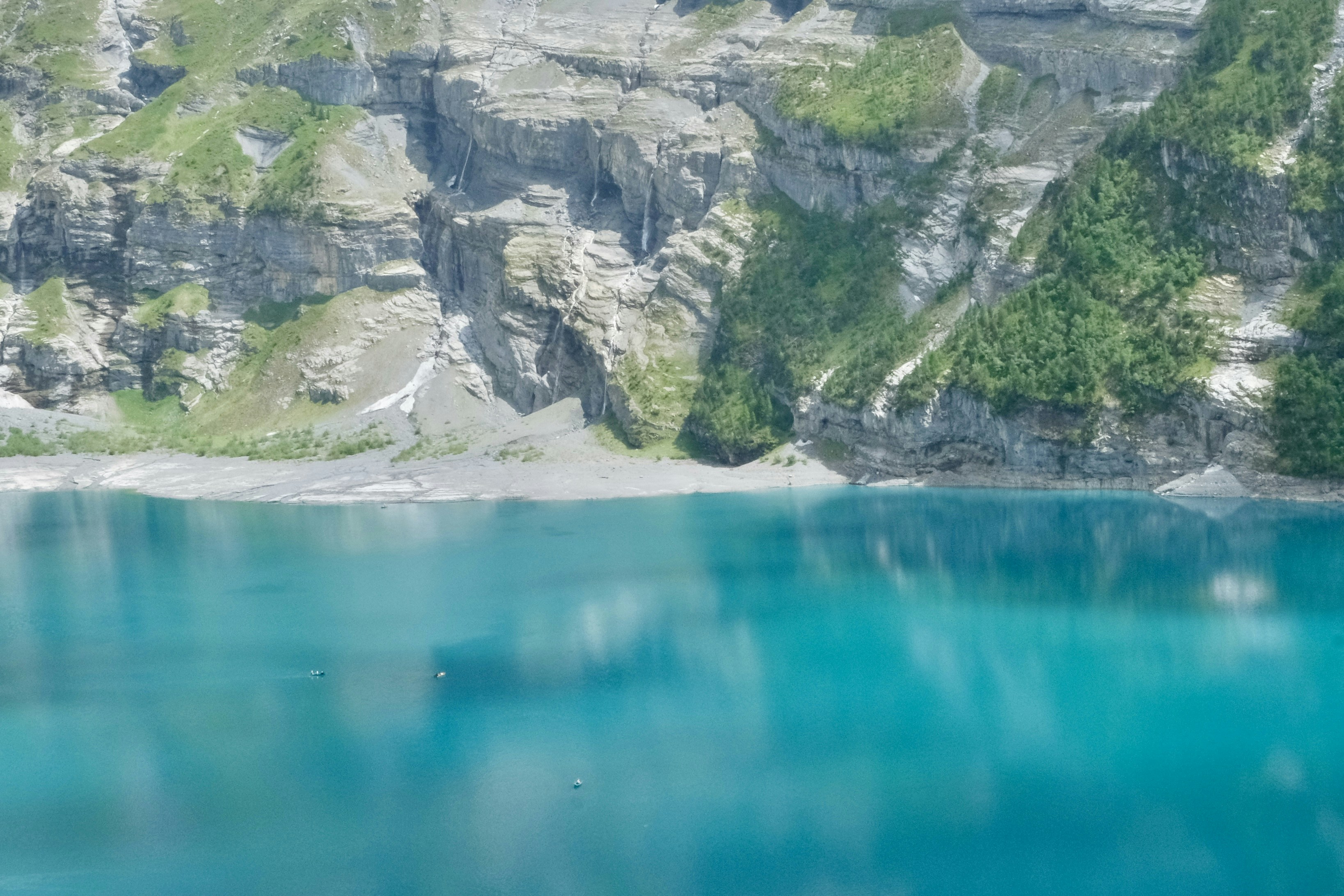 Emerald Shoreline Between Stepped Cliffs