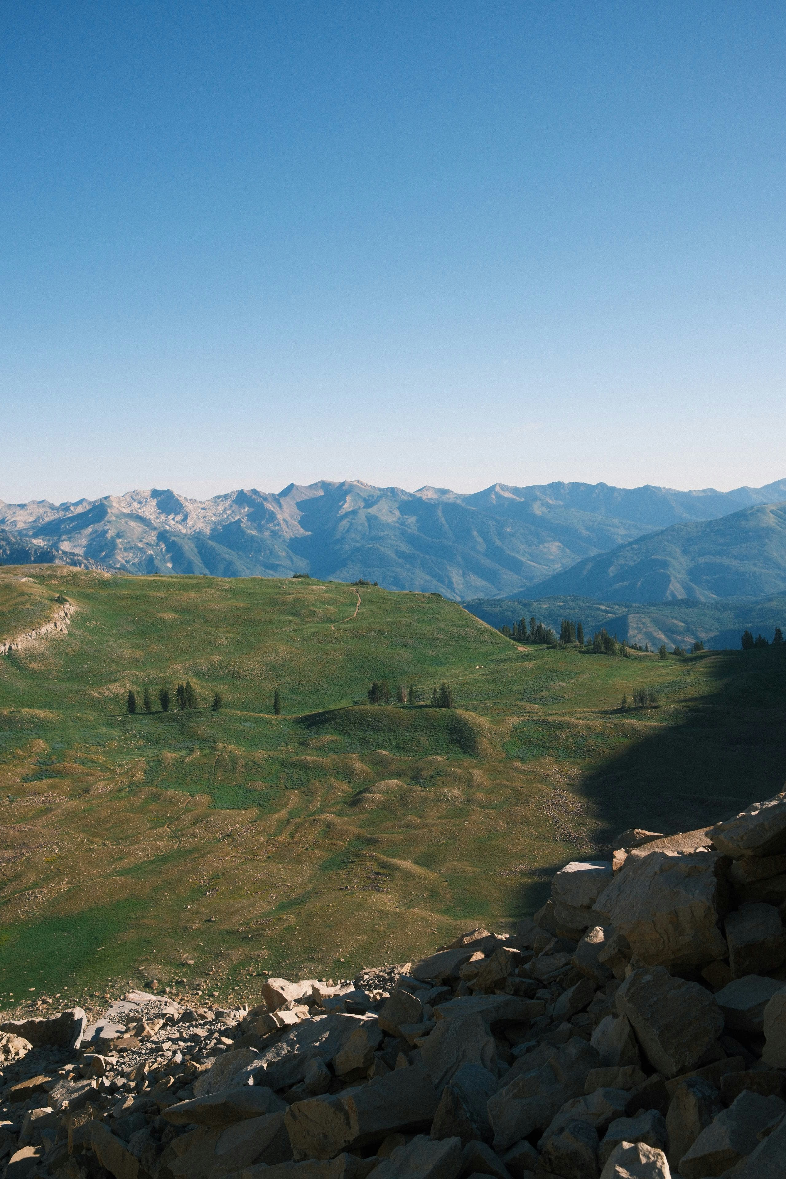 Verdant Ridge under a Clear Alpine Sky