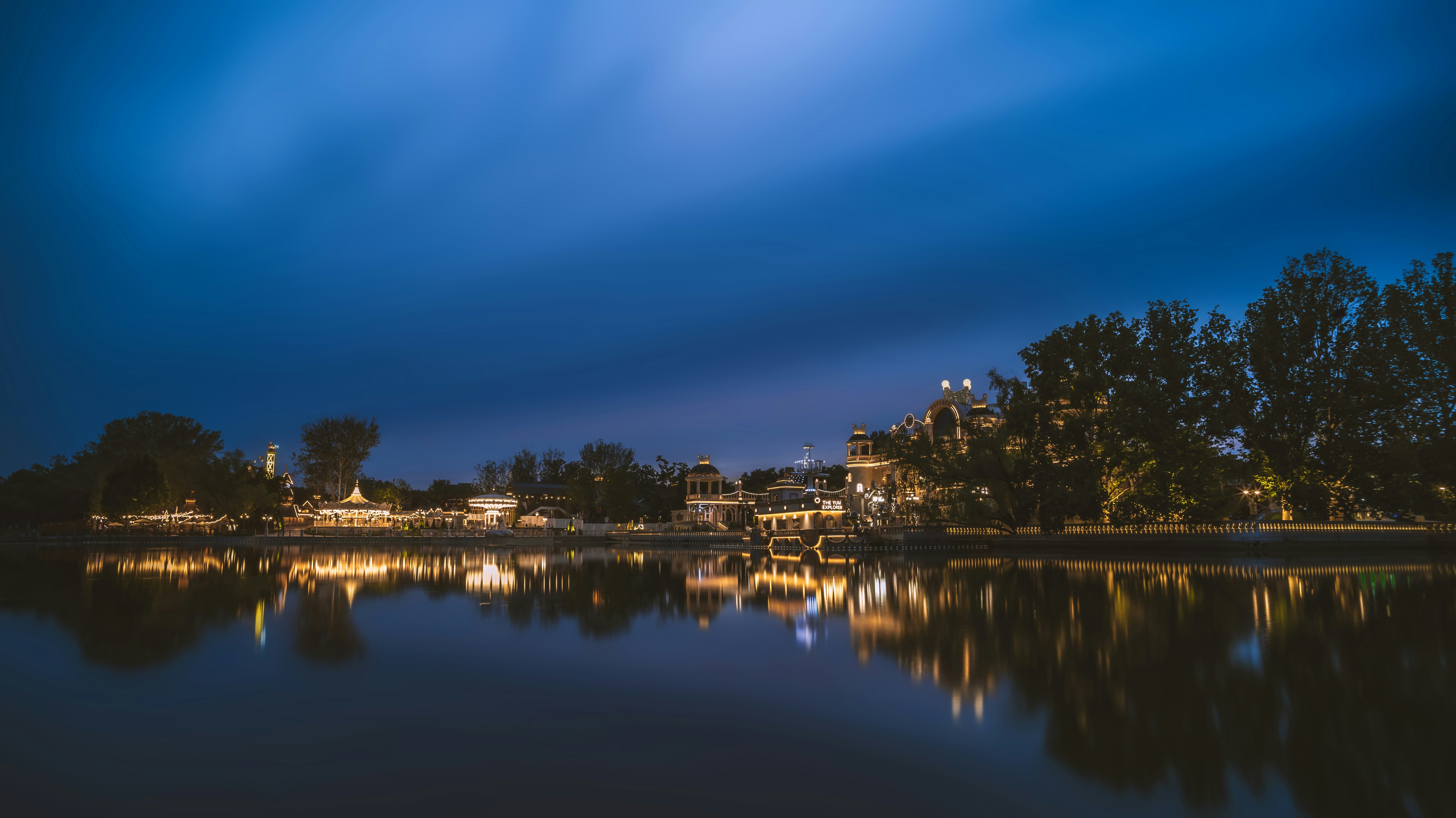 Moonlit Crest: Riverside Illumination Reflected
