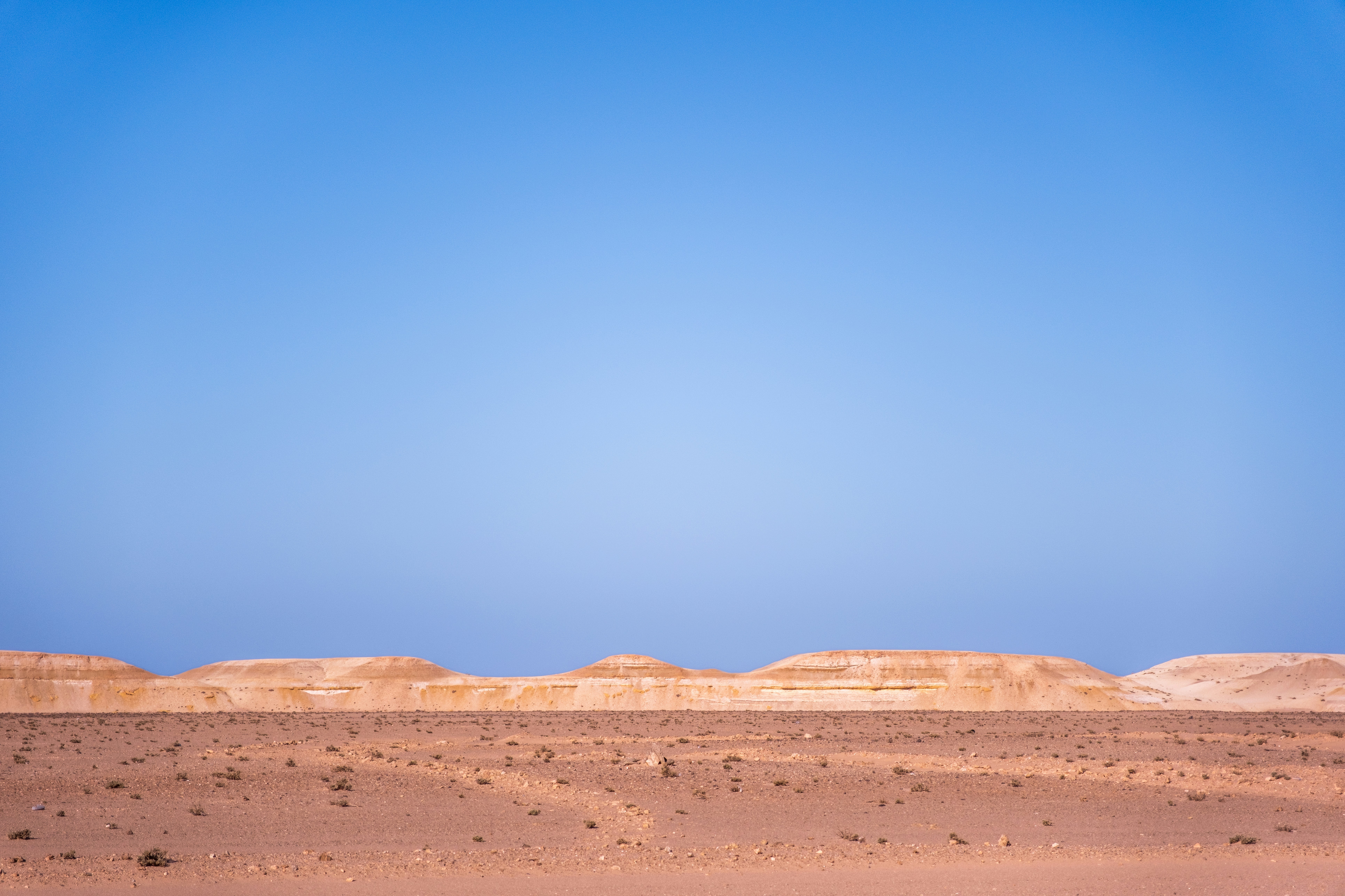 Desert Horizon: Quiet Strata Across a Shimmering Plain