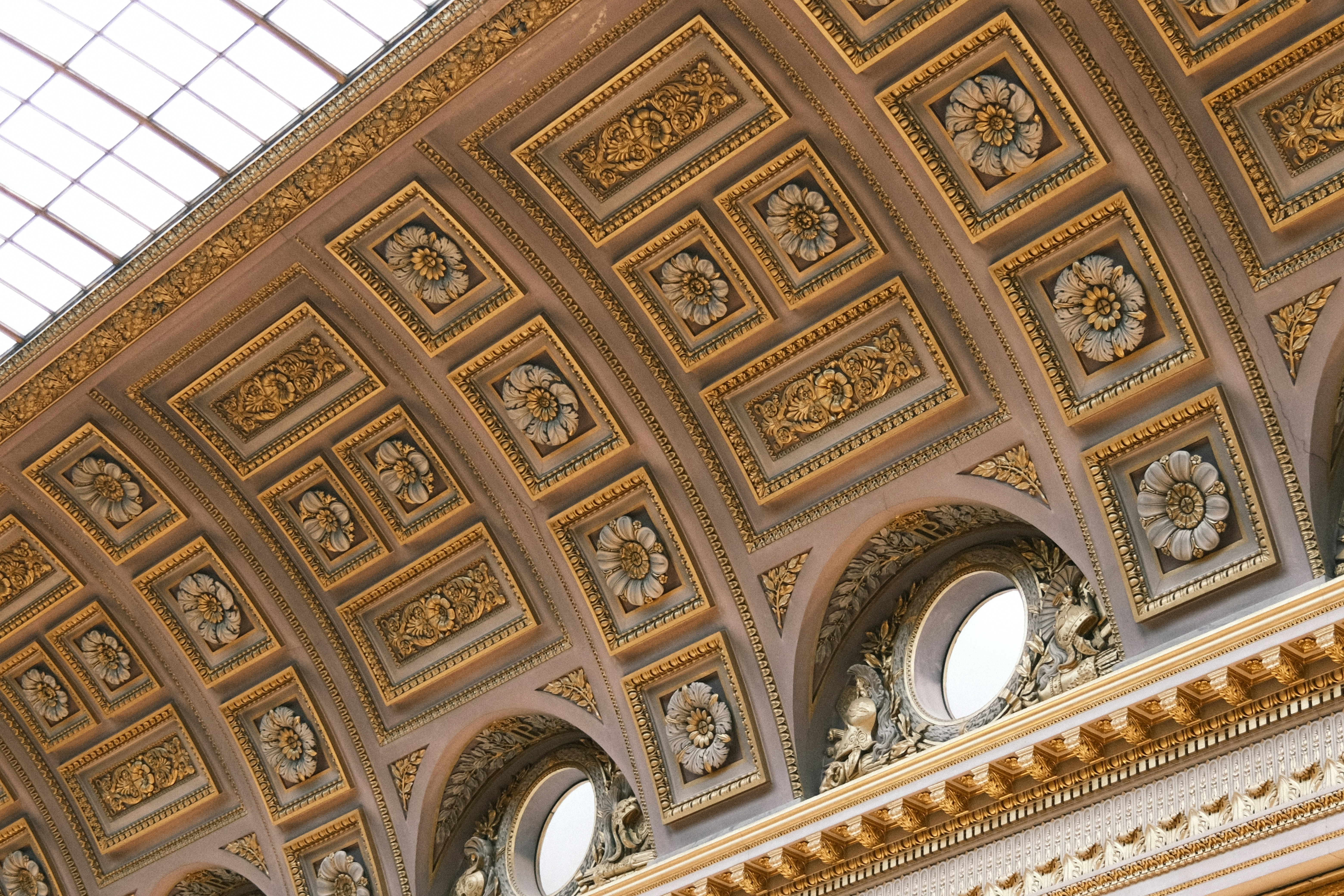 Ornate Barrel Vault: Sunlit Coffered Ceiling of a Historic Hall