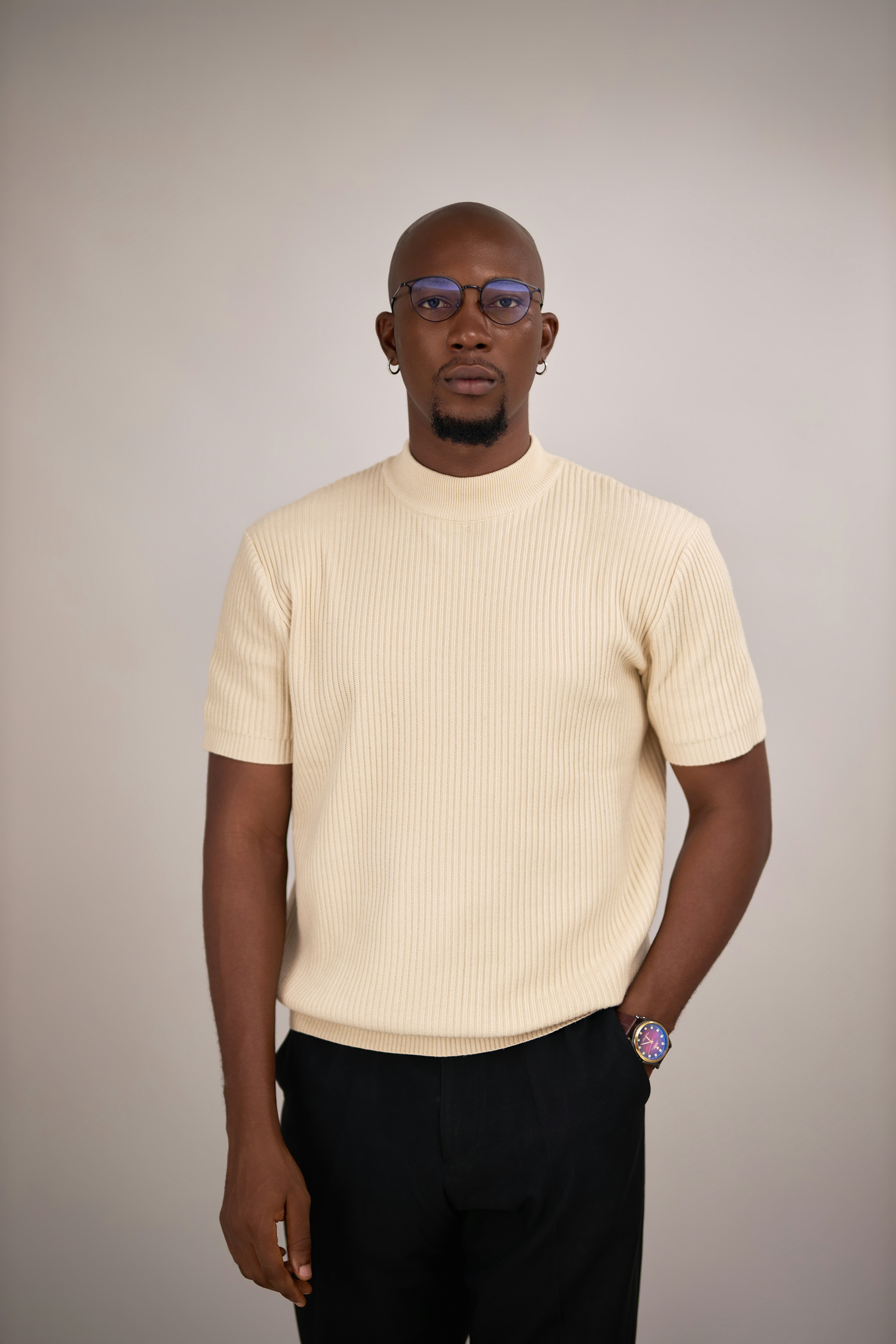 Cream Knit Portrait: A Confident Presence in Neutral Studio Light
