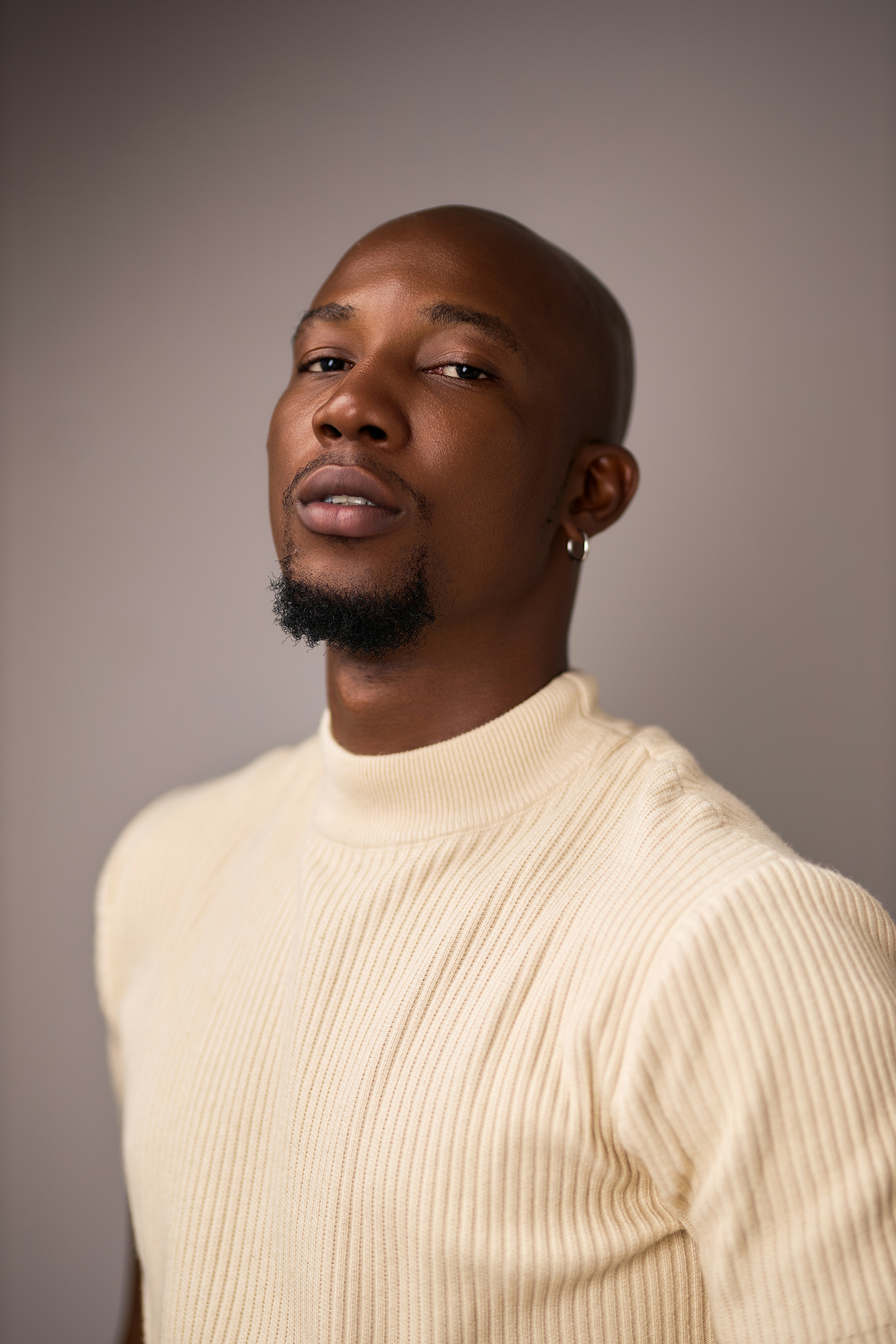 Portrait in Cream: A Quiet Confidence Under Soft Studio Light
