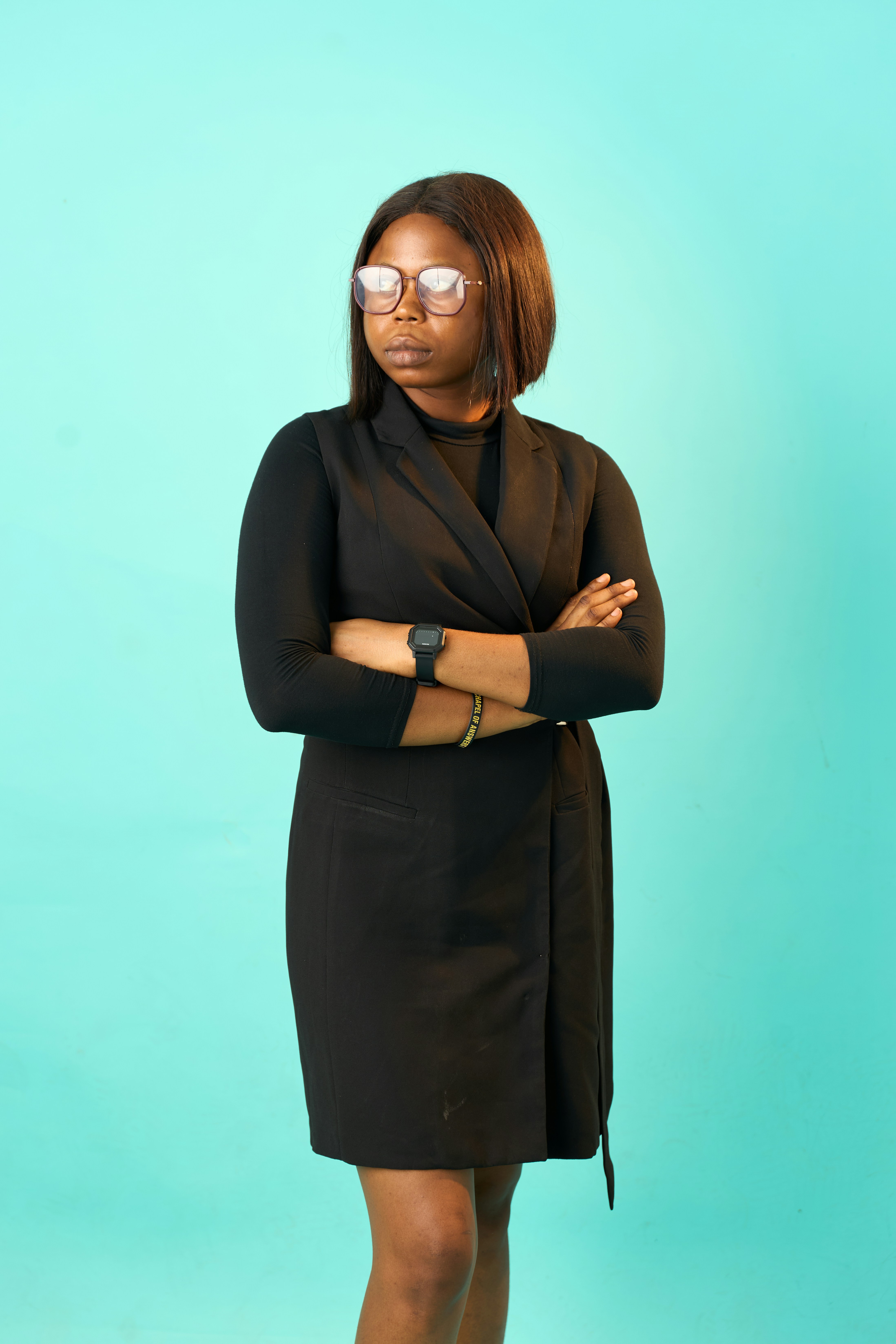 Armed with Confidence: A Fashioned Stance in Colorful Studio