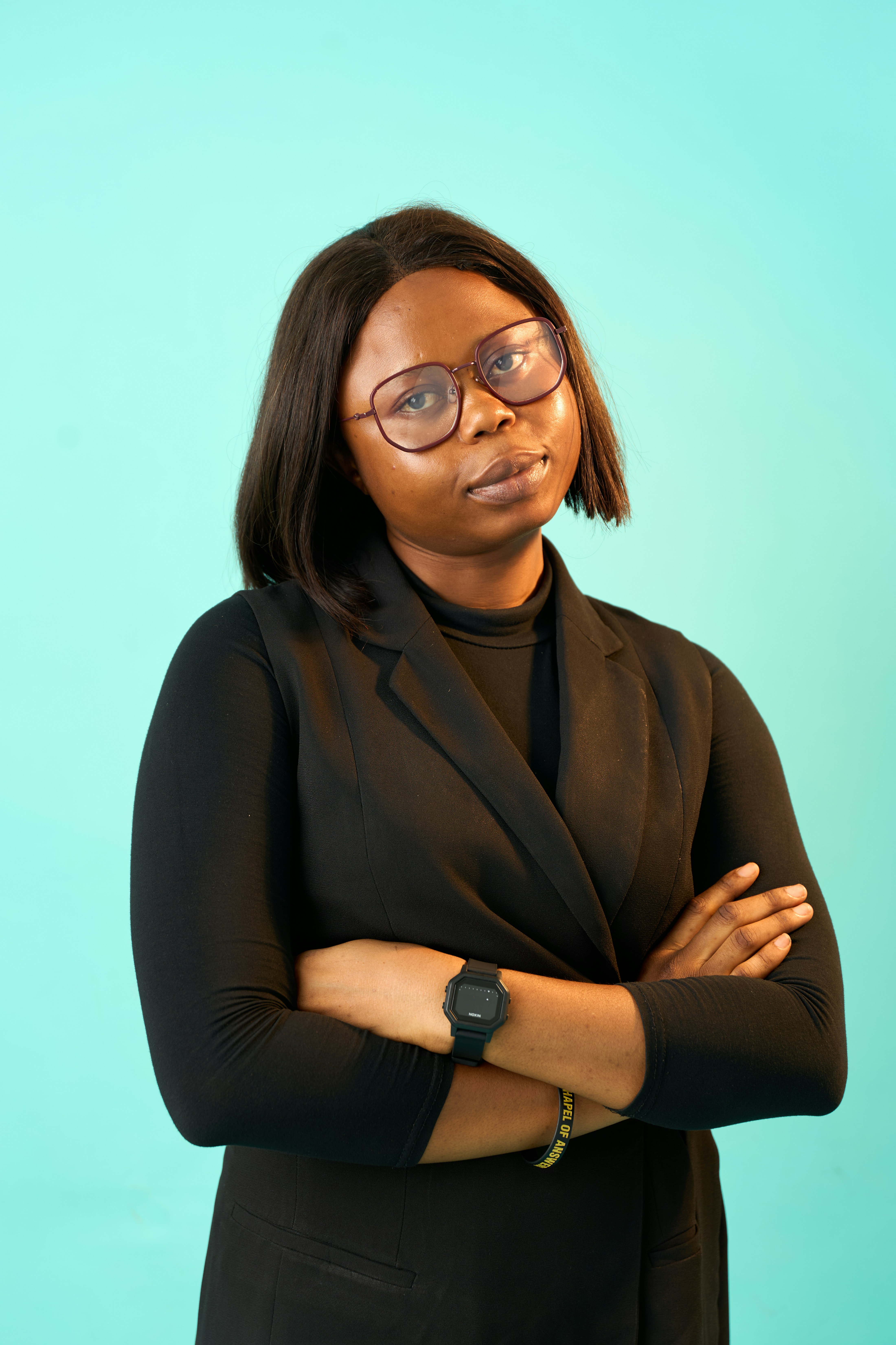 Portrait in Color: A Confident Moment Framed Against Turquoise