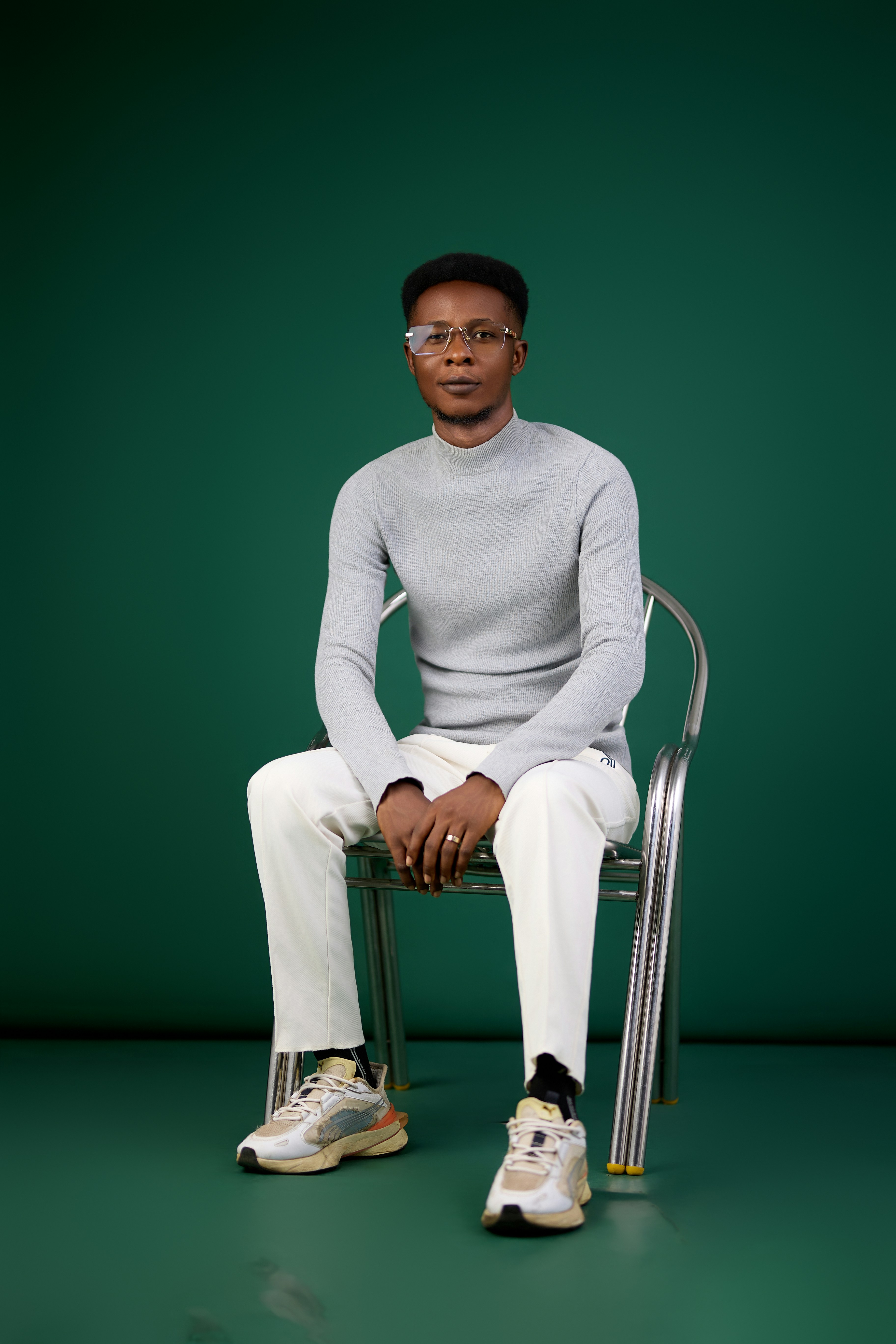 Portrait in Emerald Studio: Quiet Confidence on a Green Backdrop