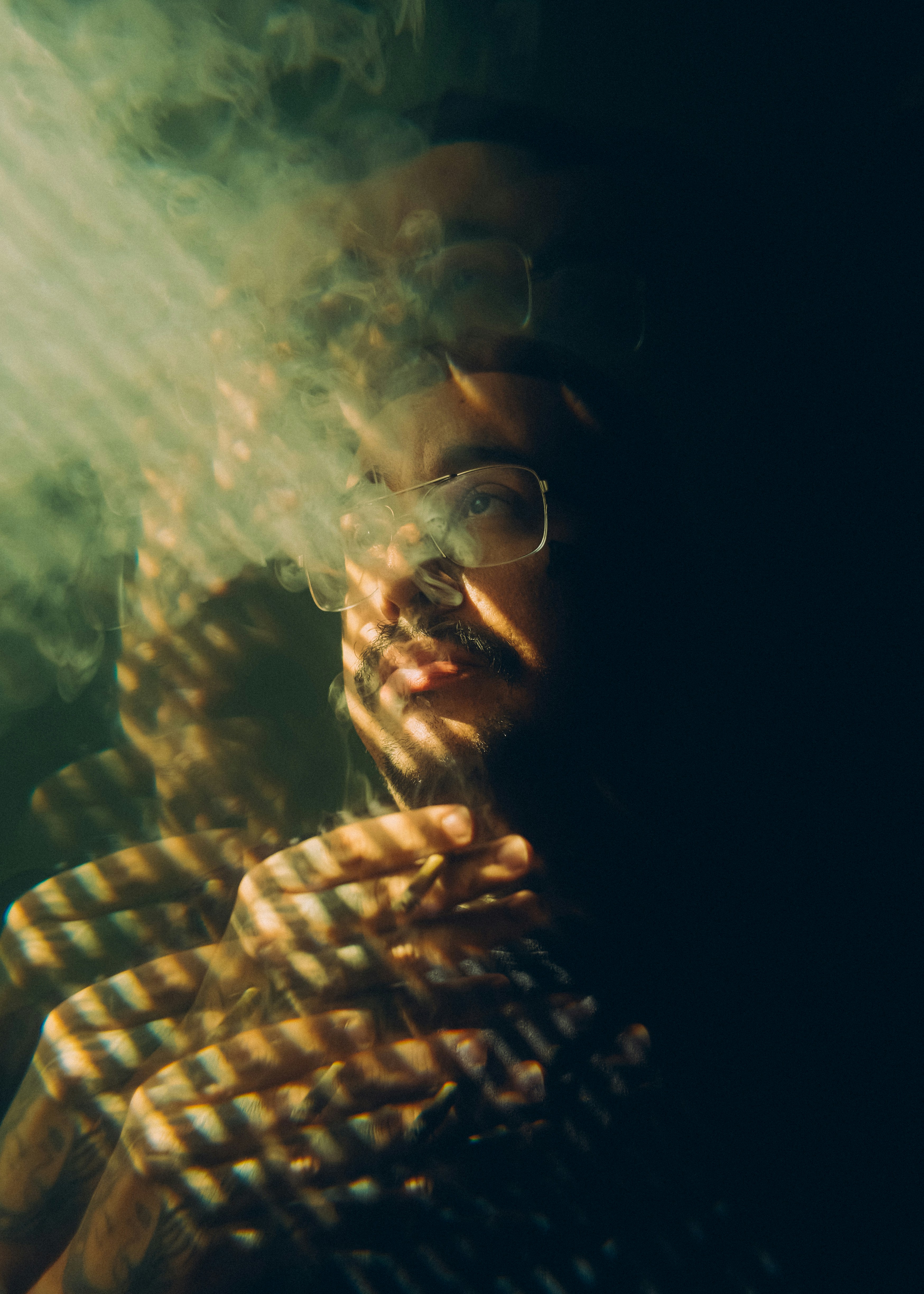 Shadowed Gaze: A Portrait in Smoke and Light