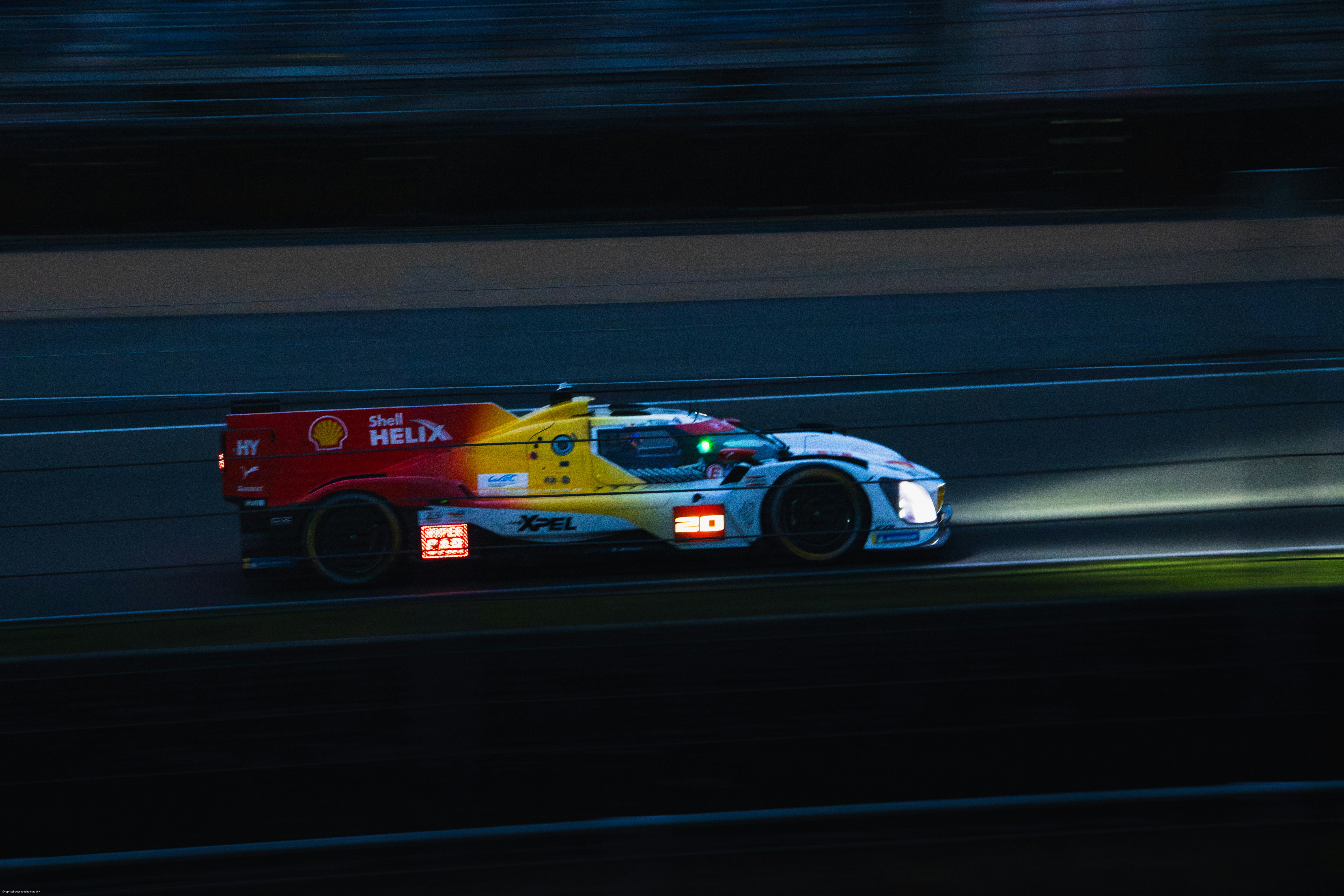 Speed Demon in Red and Yellow: A Nighttime Le Mans-style Dash