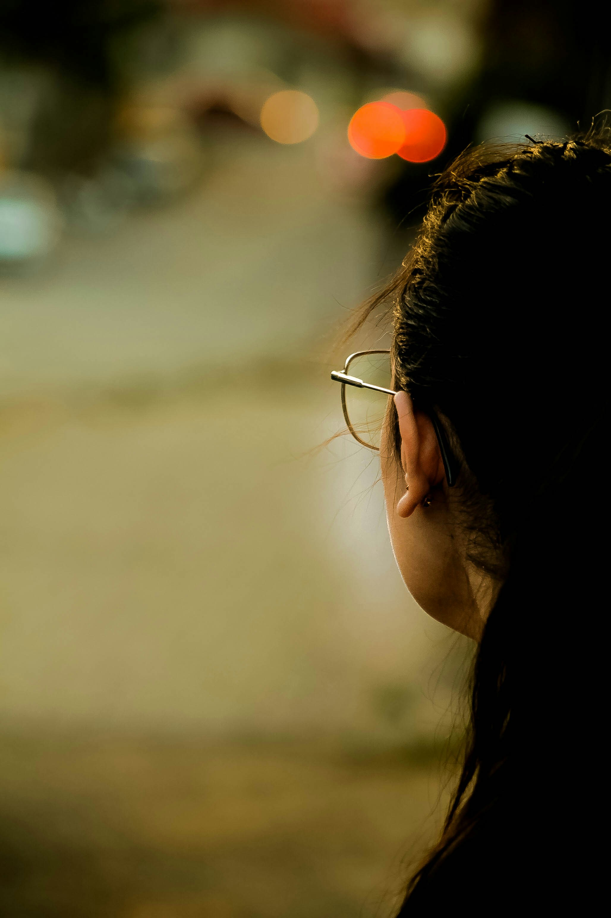 Glance Beyond the Glass: A Quiet Street Portrait in Evening Light