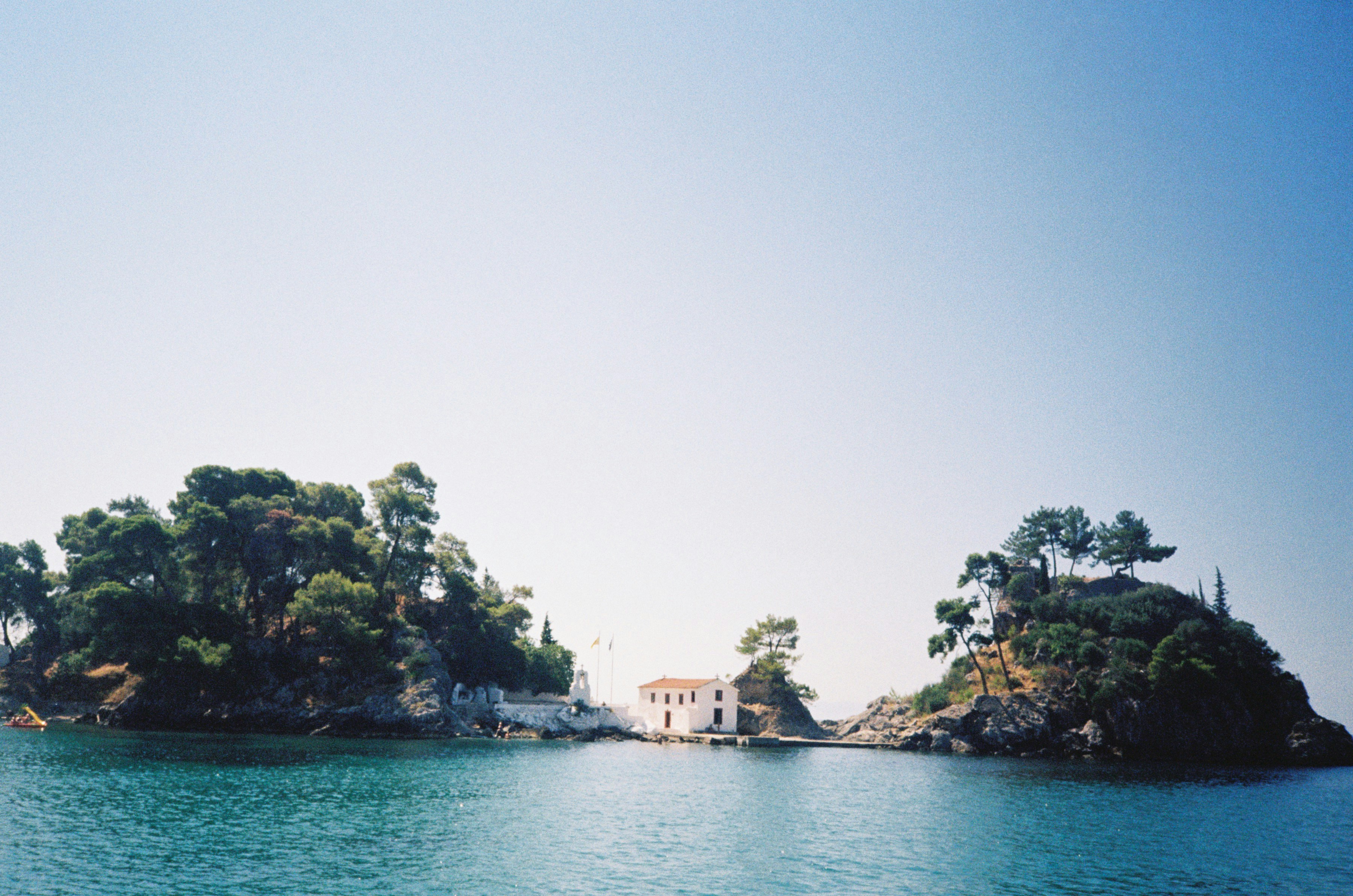 Tiny House of the Sea: A Secluded Island Chapel Between Peaks