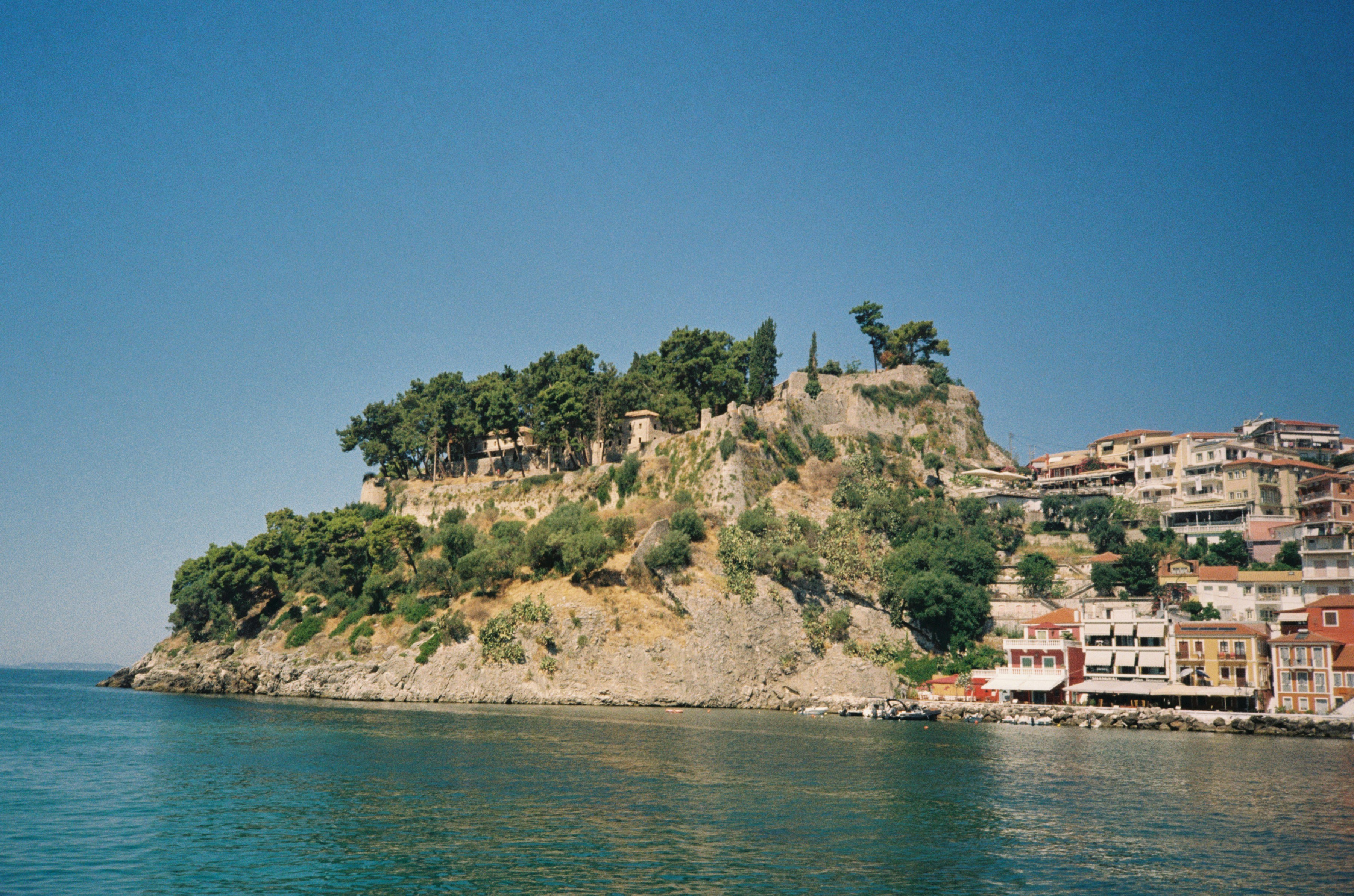 Harbor Cliff: Sunlit village anchored to a rocky promontory