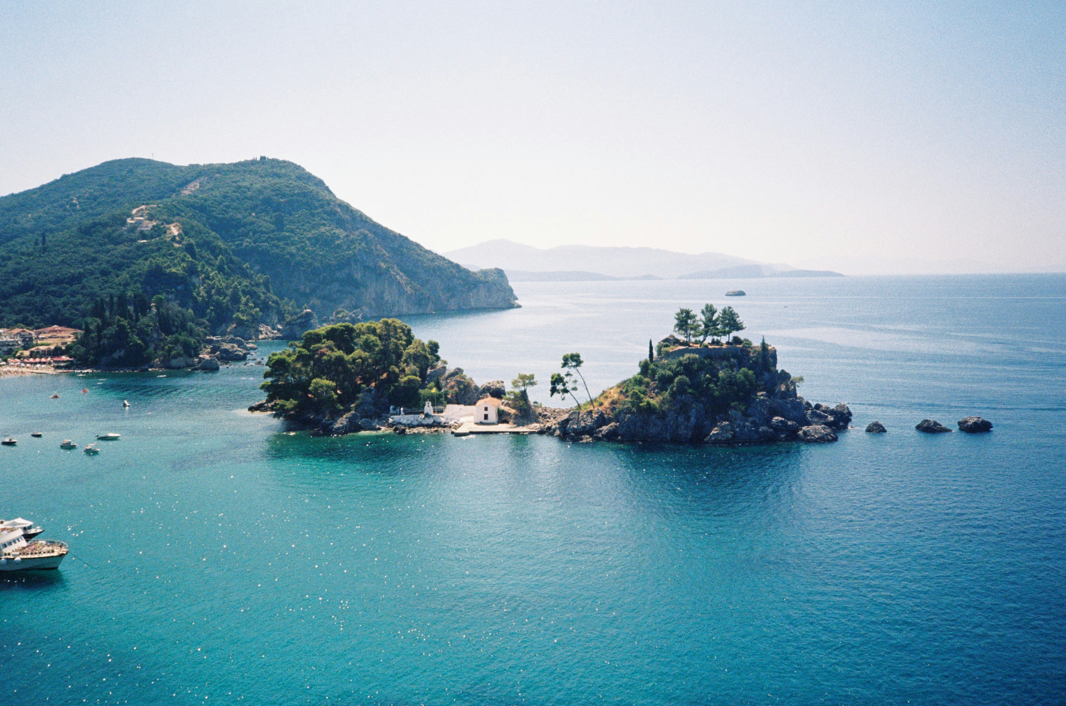 Island Crest Amid Serene Azure: A Coastal Panorama